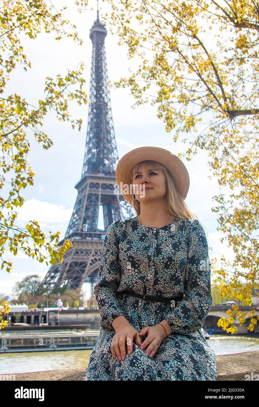 Woman in a hat near the eiffel tower. Selective focus. People Stock ...