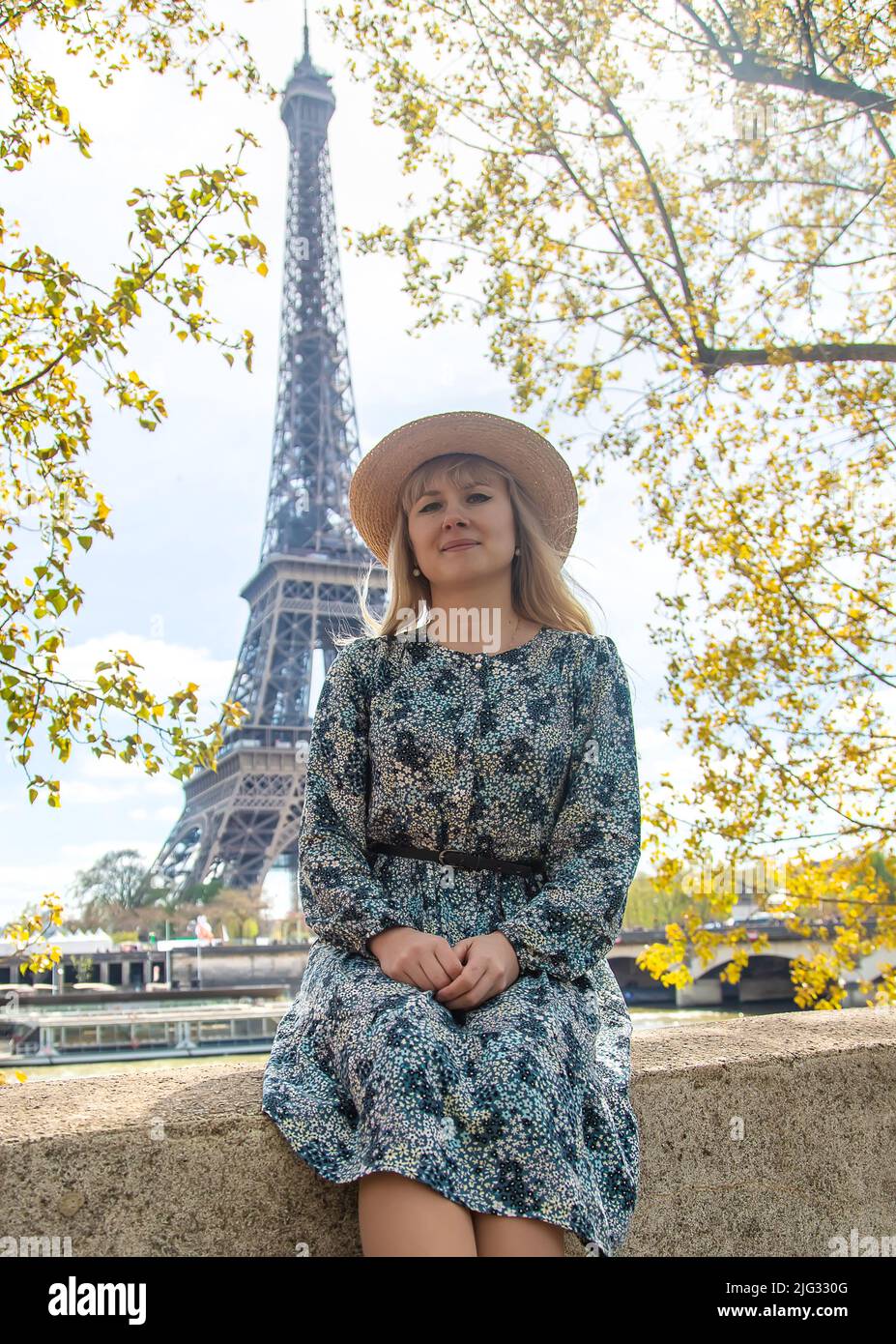 Woman in a hat near the eiffel tower. Selective focus. People Stock ...