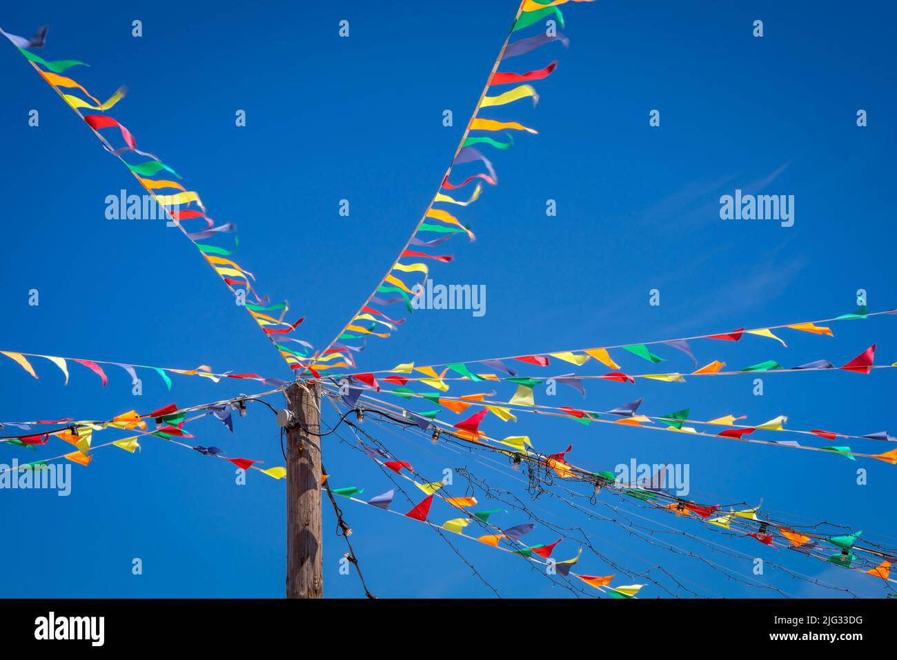 multi-colored festive flags at the fair flutter in the wind Stock Photo ...