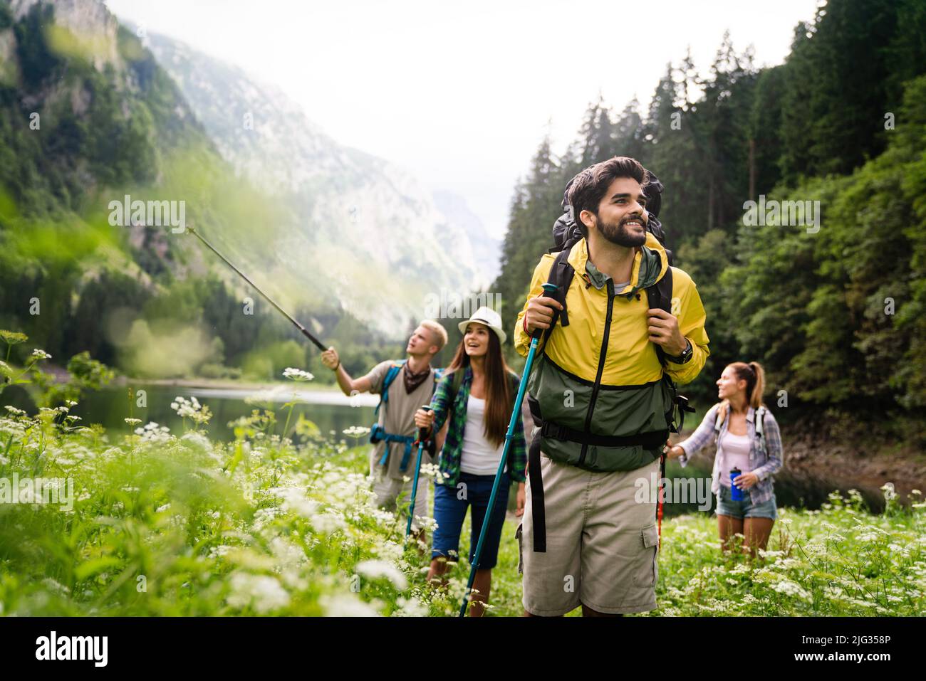 Group of happy friends enjoying outdoor activity together Stock Photo ...