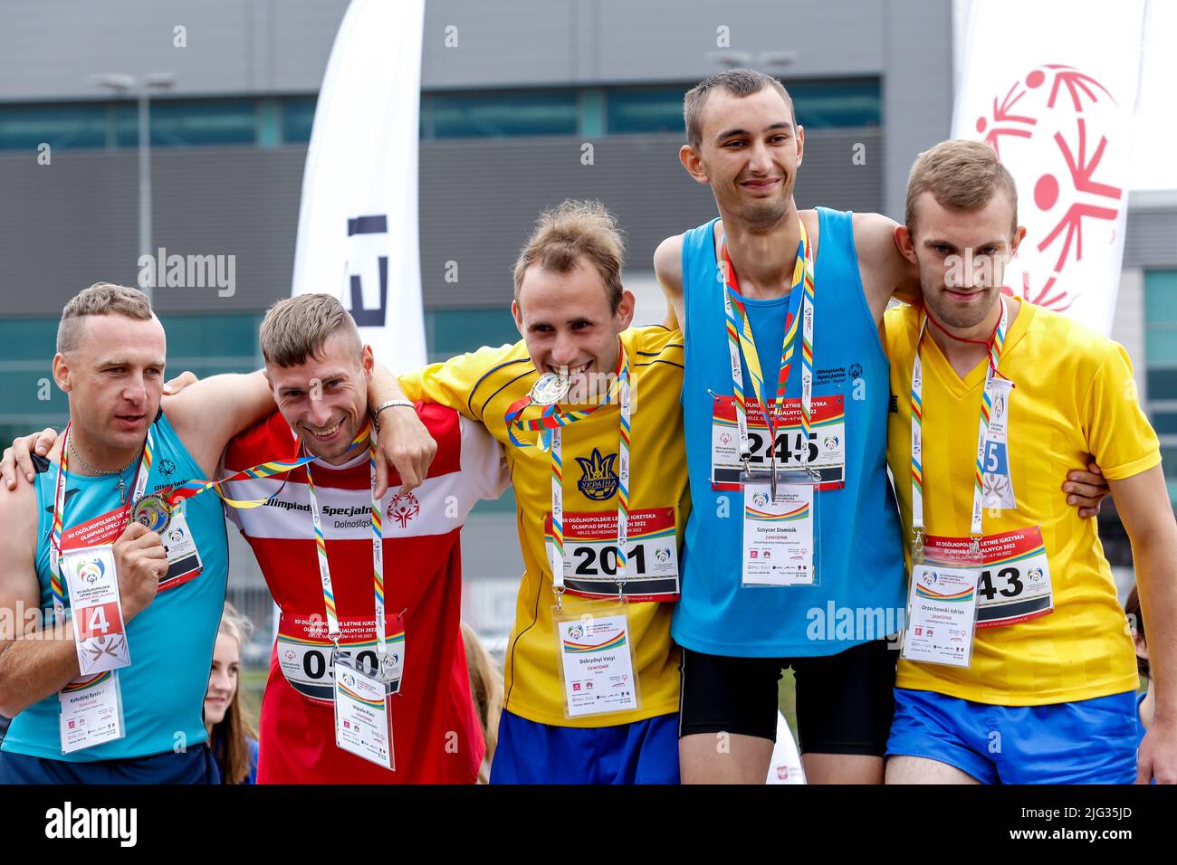 Athletes from Poland and Ukraine show joy as they receive a medals ...