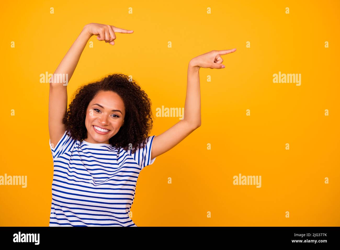 Portrait of cheerful charming person indicate fingers empty space blank ...