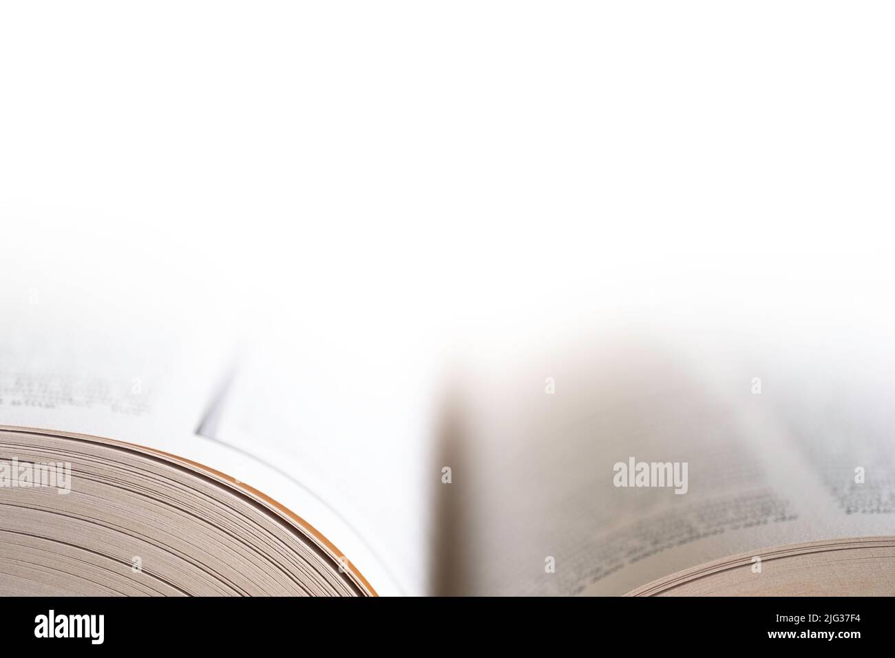 Open book with columns of text on the pages with white background ...