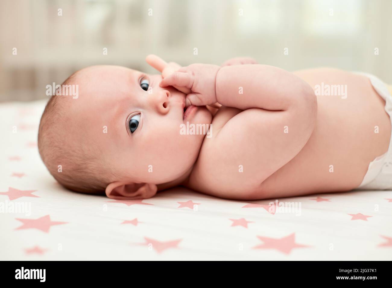 newborn baby girl looks straight. Close up Stock Photo - Alamy