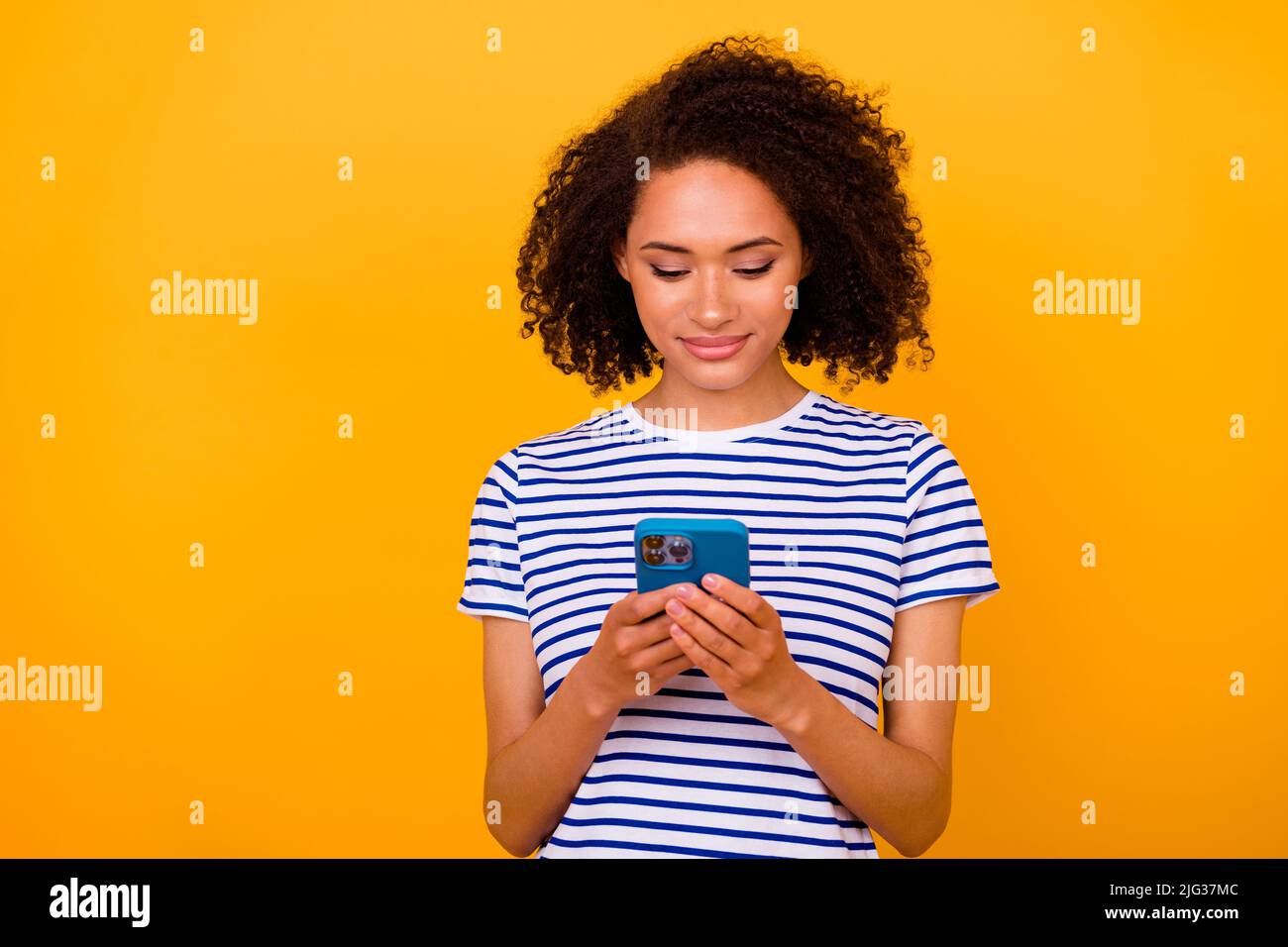 Photo of cute positive girl hands hols telephone typing chatting ...