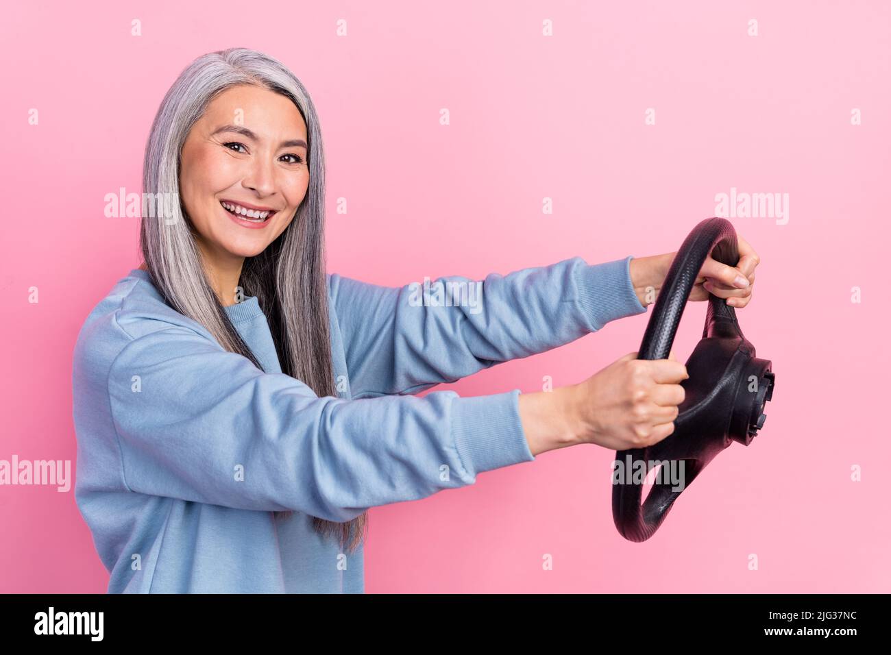Photo of funny sweet lady pensioner dressed blue pullover driving ...