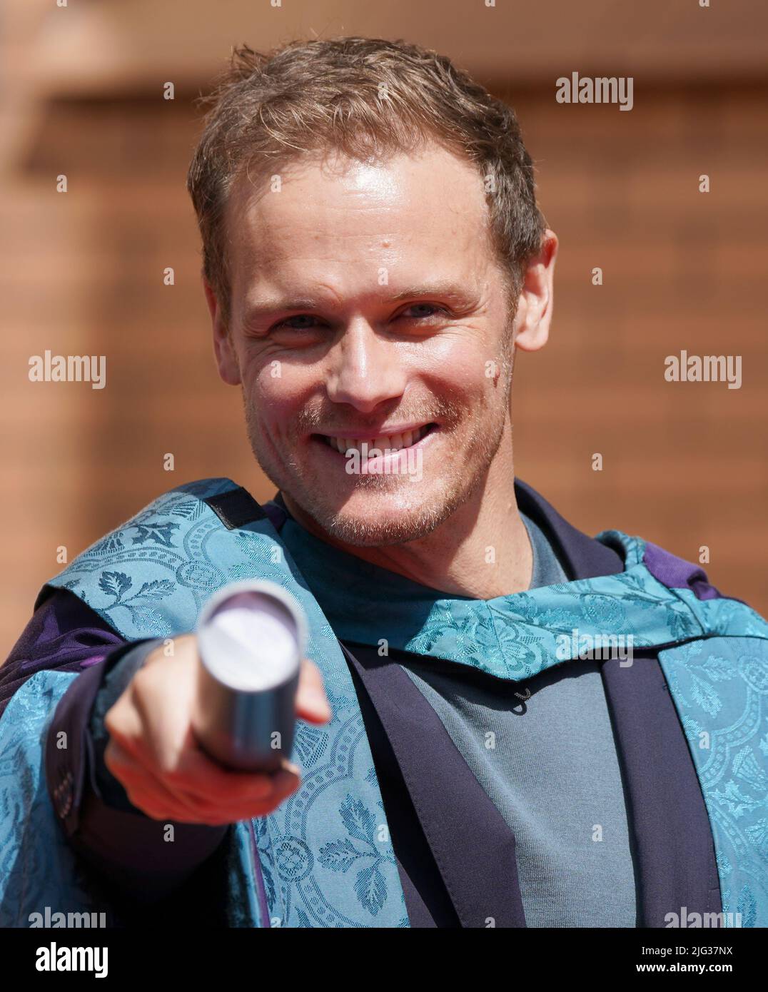 Outlander actor Sam Heughan with his honorary doctorate after receiving ...