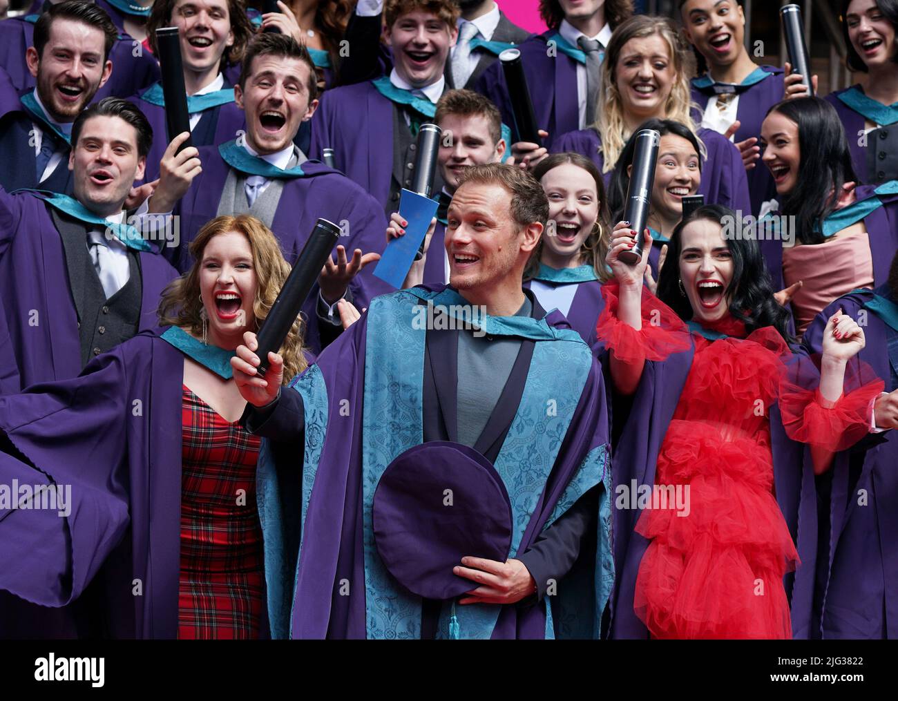 Outlander actor Sam Heughan with his honorary doctorate alongside other ...