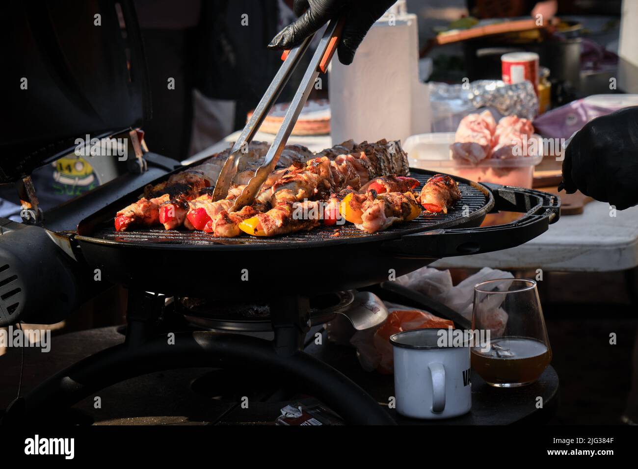 Outdoor fast food restaurant in park. Roast kebab meat and grilled ...