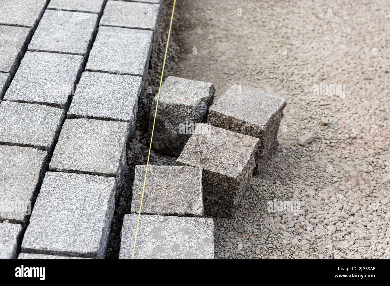 Construcion site of pavement granite cobblestone road in old city ...