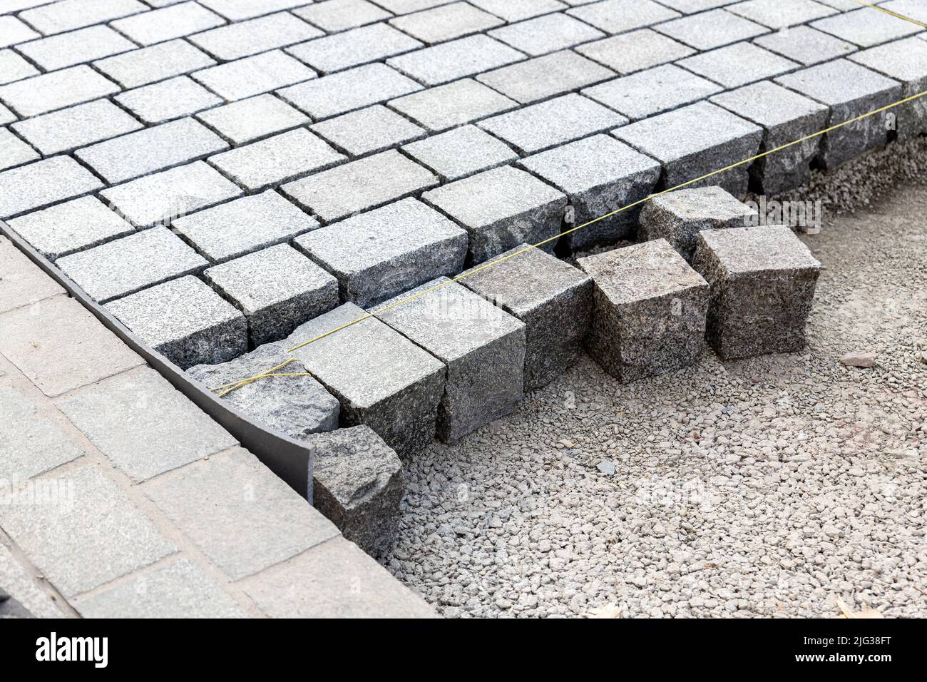 Construcion site of pavement granite cobblestone road in old city ...