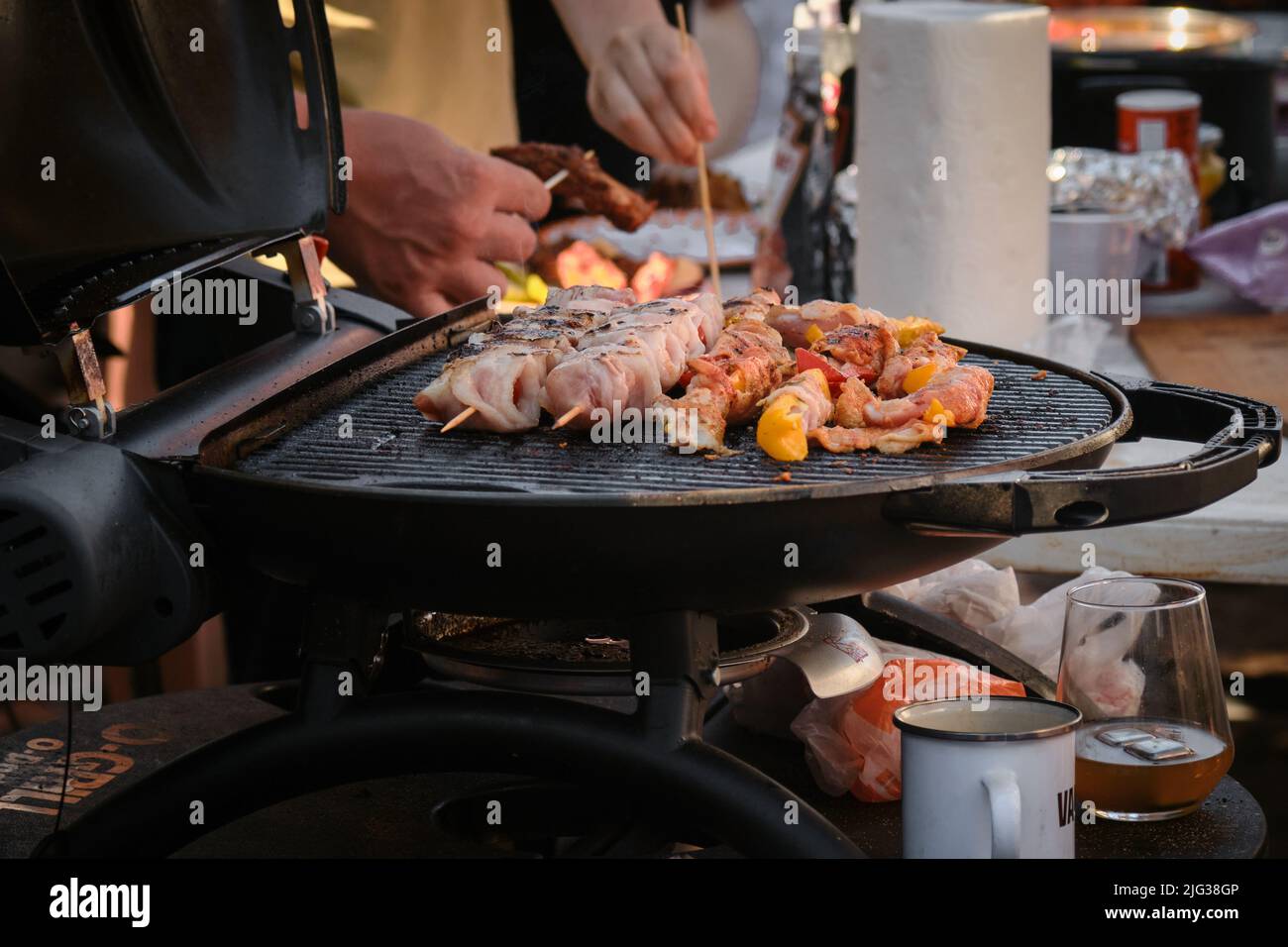 Outdoor fast food restaurant in park. Roast kebab meat and grilled ...