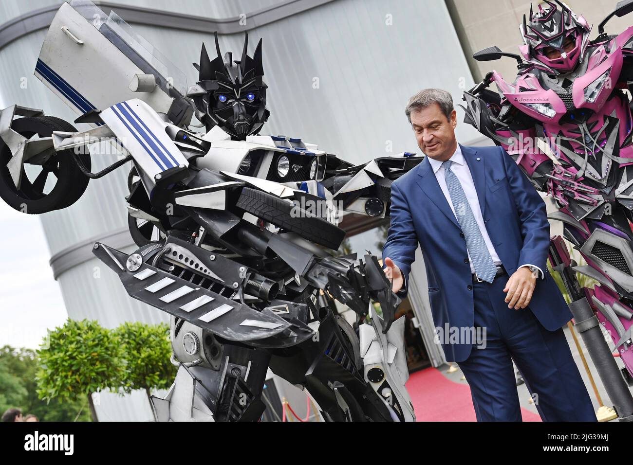 Munich, Germany. July 7th, 2022: Two Transformer robots welcome Markus ...