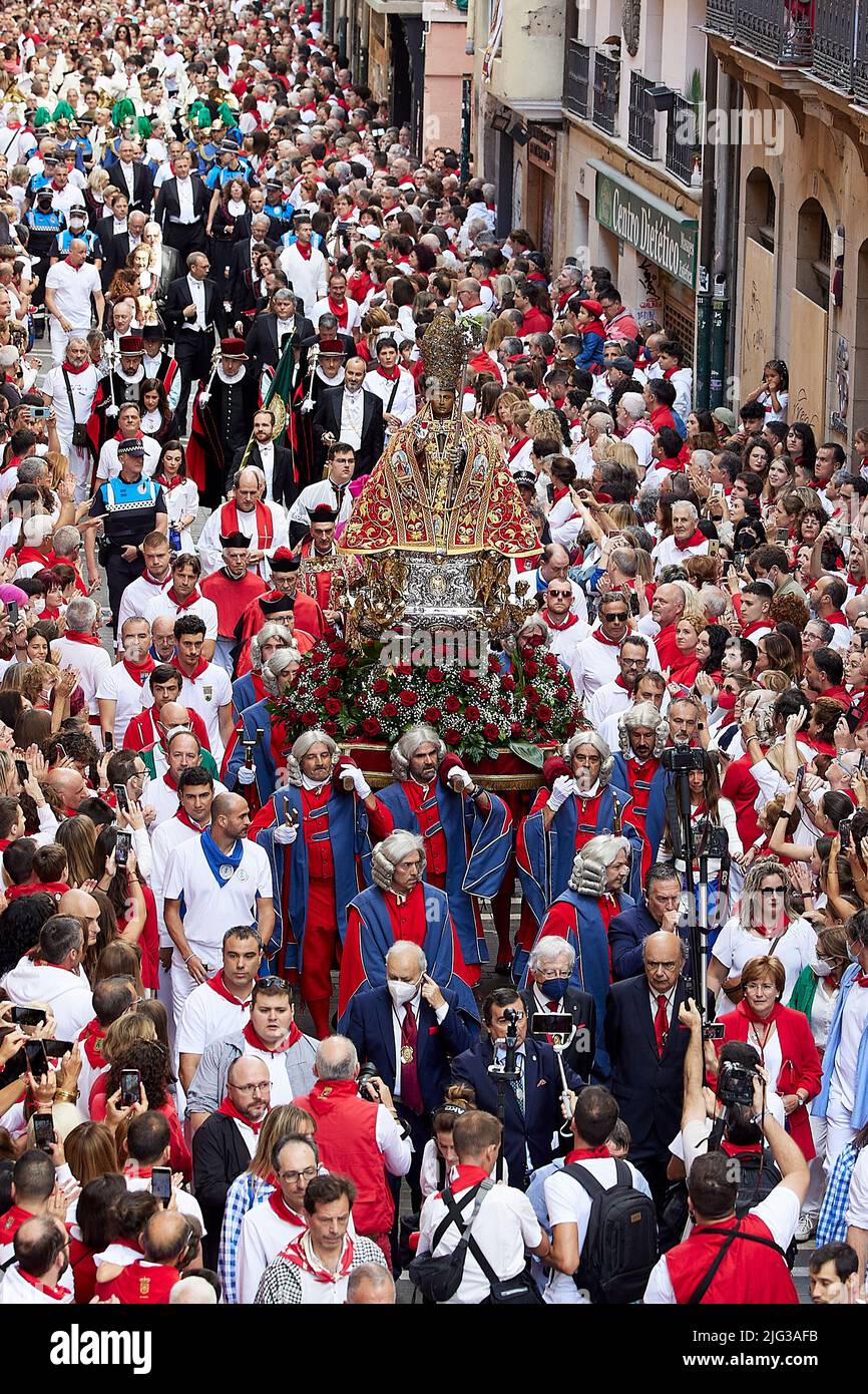 People attend the San Fermin procession during the traditional San ...
