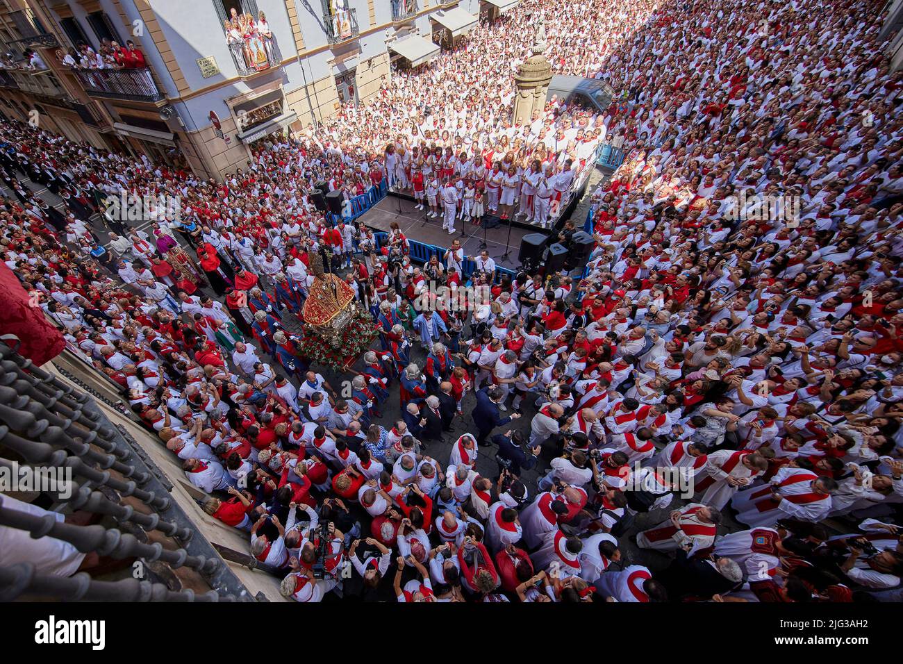 People attend the San Fermin procession during the traditional San ...