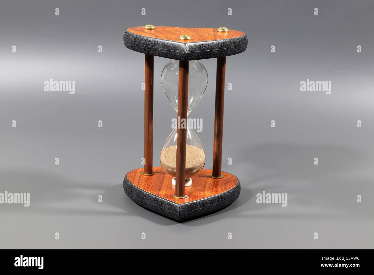 wooden hourglass on colored background Stock Photo - Alamy