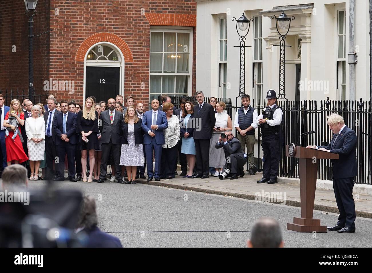 Prime Minister Boris Johnson, watched by wife Carrie Johnson (far left ...