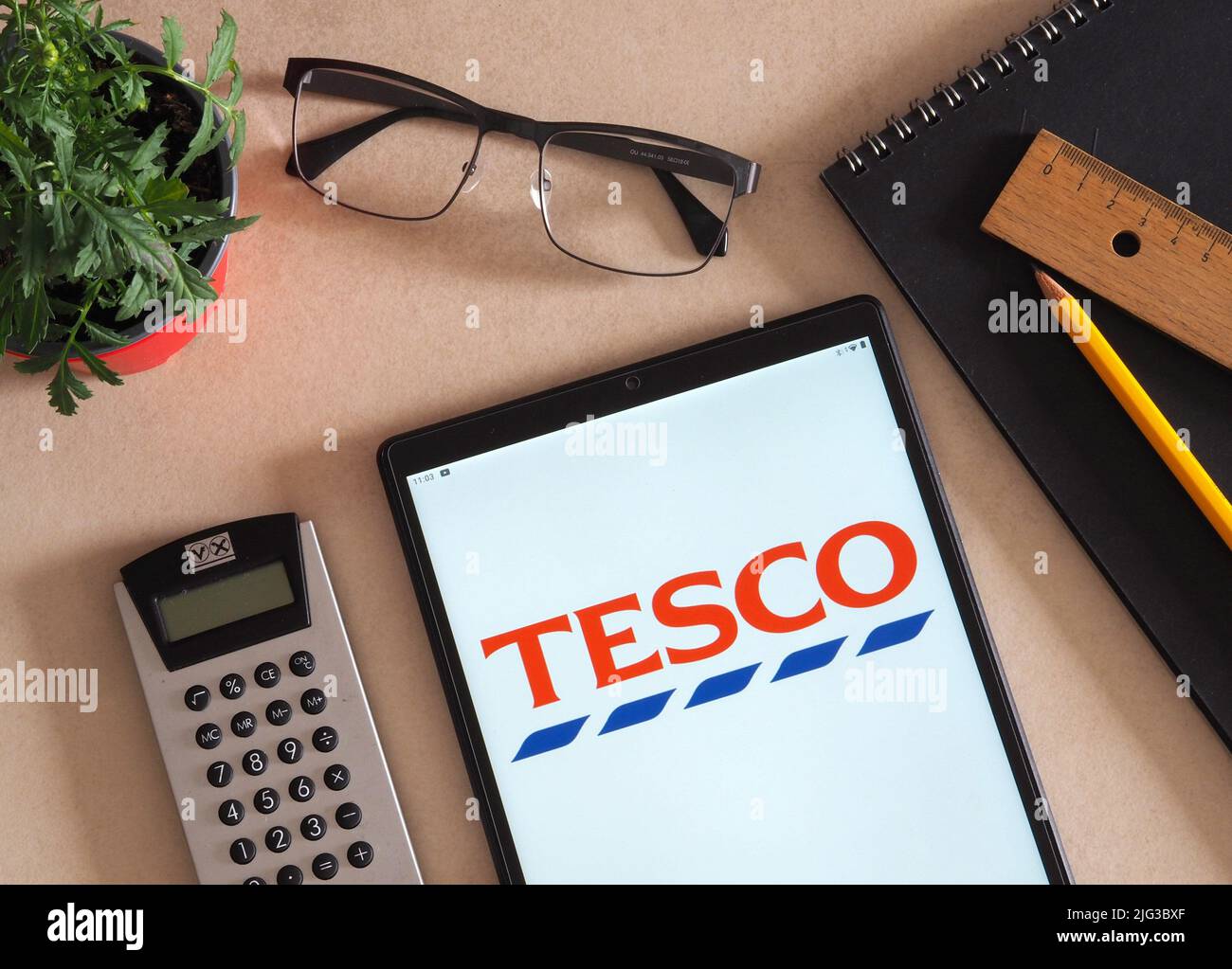 In this photo illustration, Tesco PLC logo seen displayed on a tablet ...