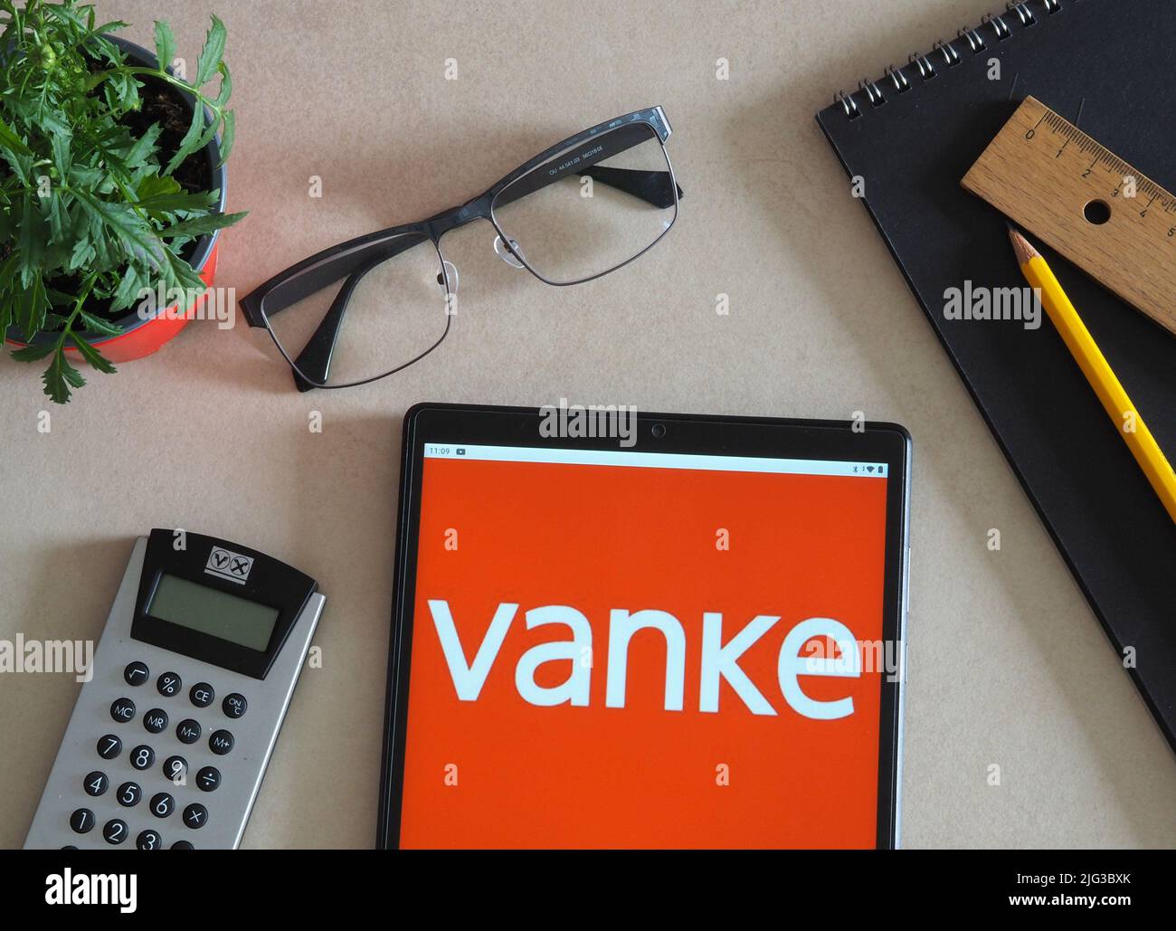 In this photo illustration, Vanke Co., Ltd. logo seen displayed on a ...