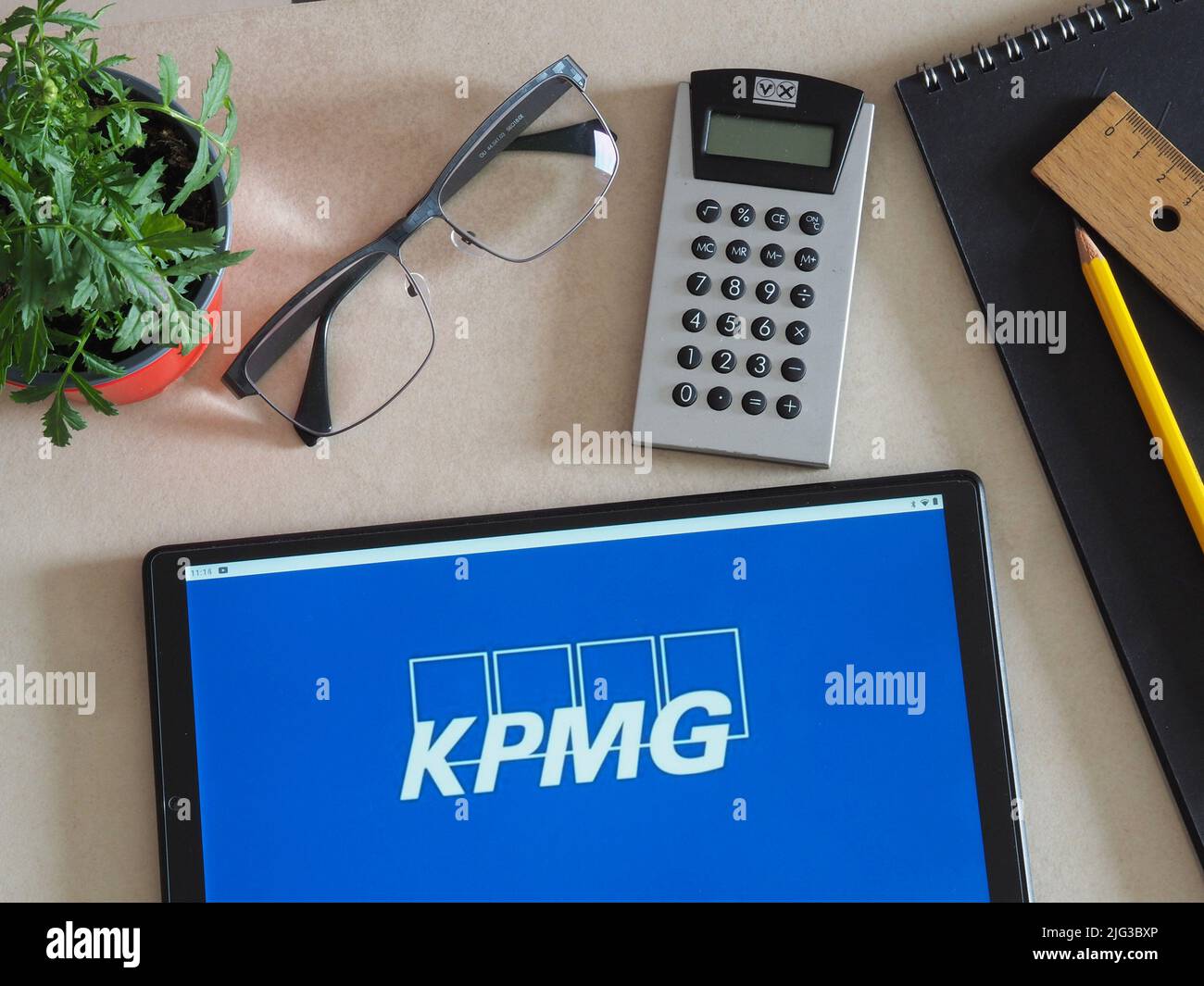 In this photo illustration, KPMG International Limited logo seen ...