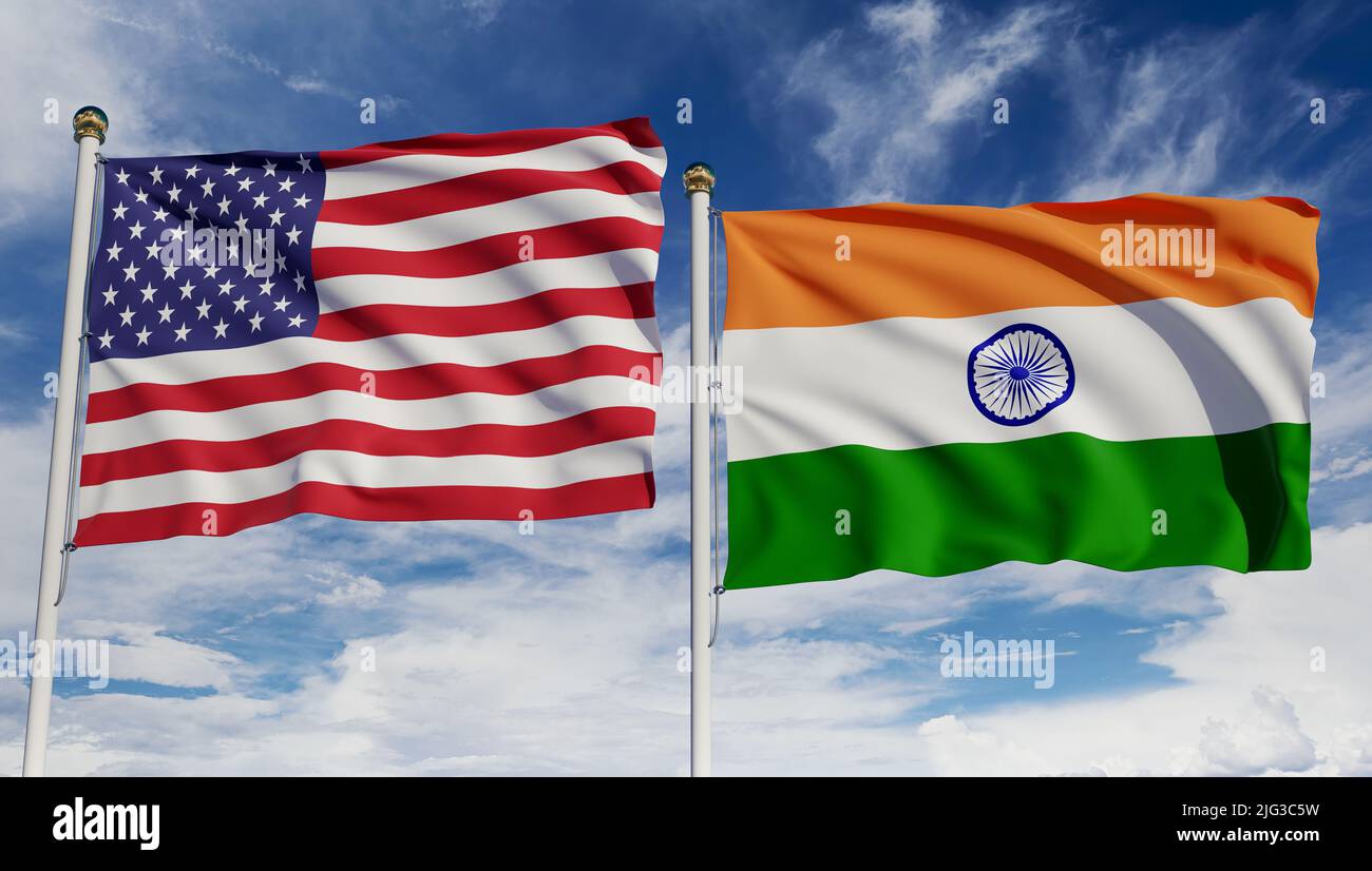 American and Indian flags over blue sky. Concept of diplomacy ...