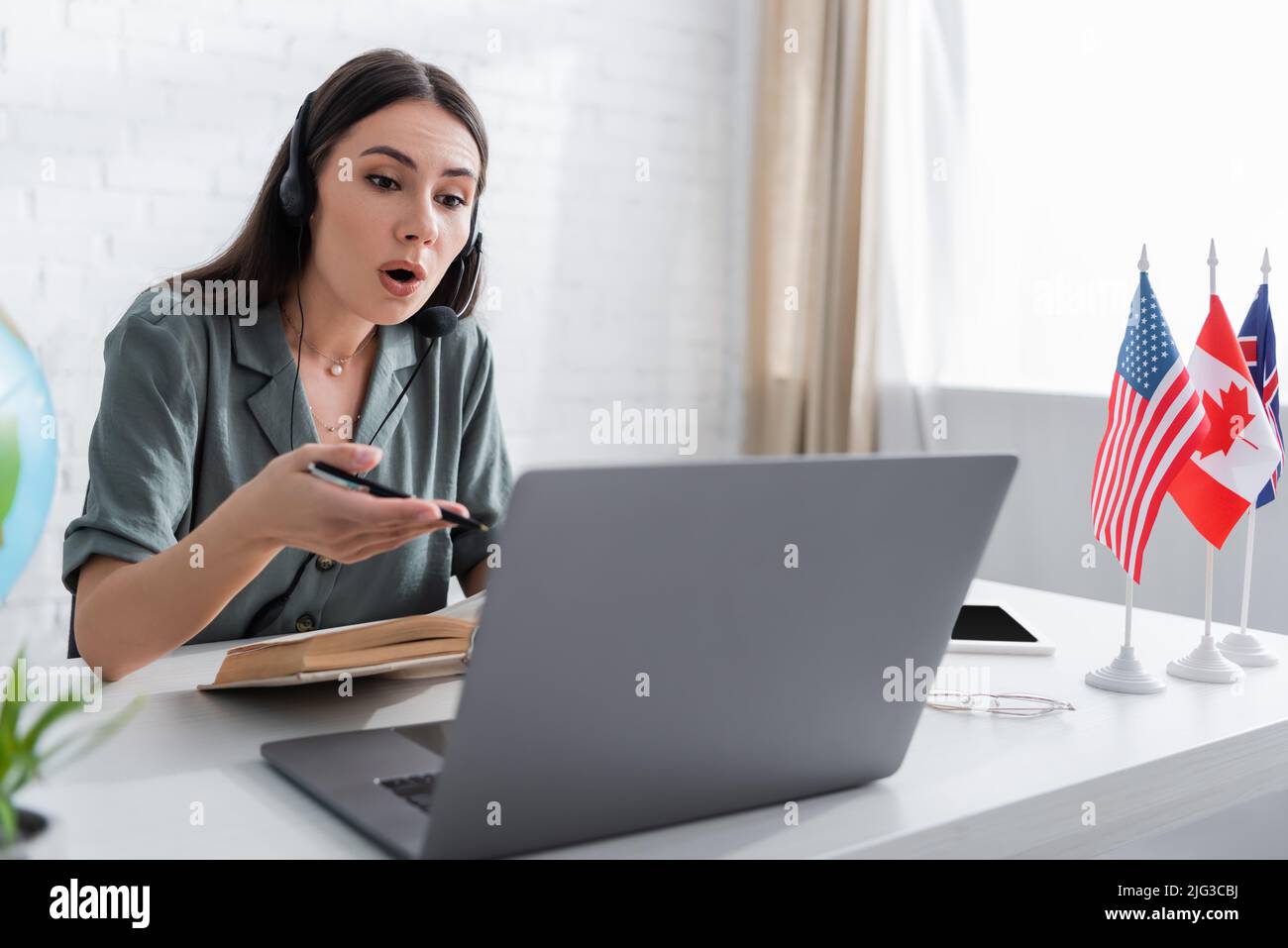 Laptop with globe flags hi-res stock photography and images - Alamy