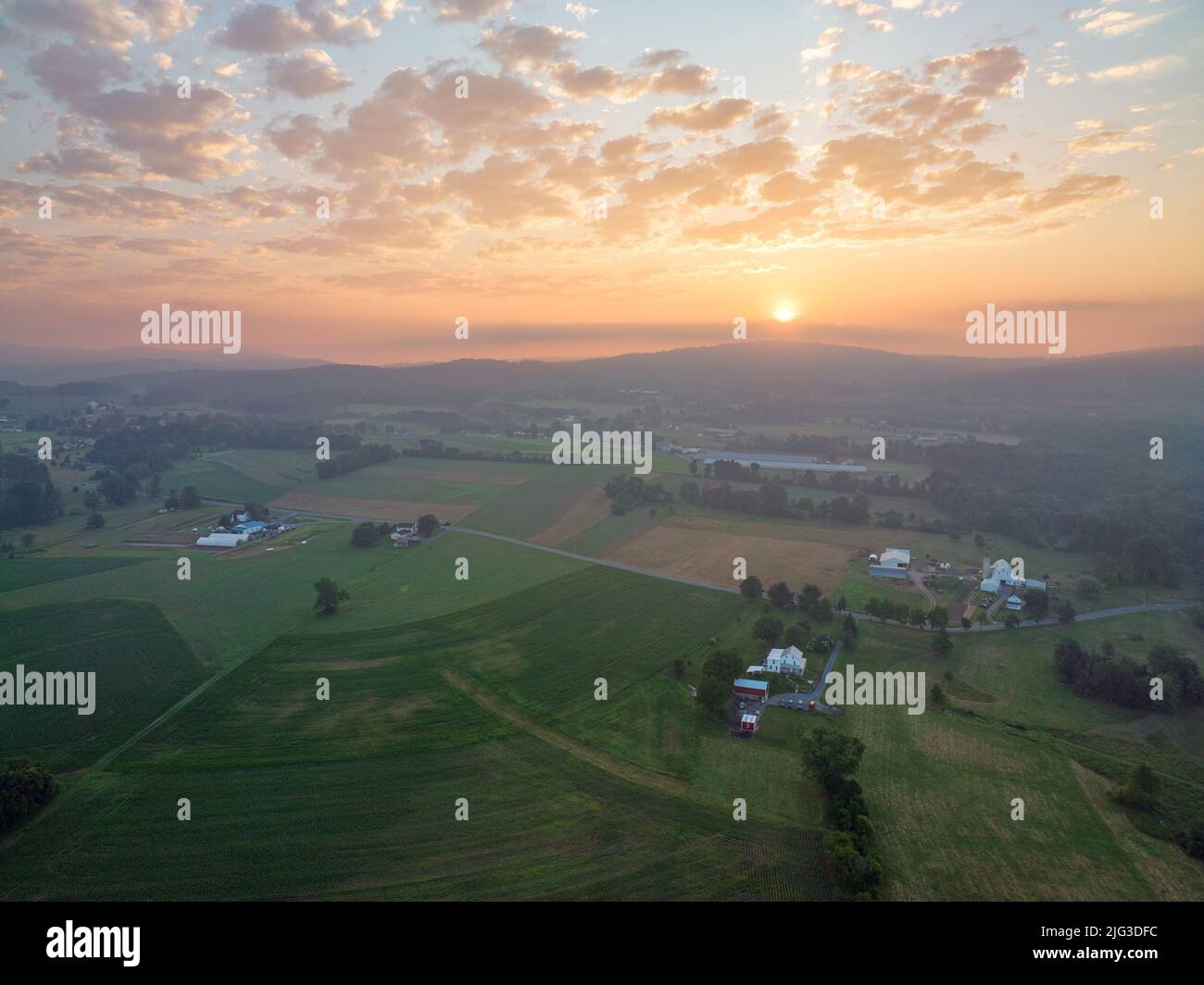 An aerial view of a morning sunrise over the farmland in Lancaster ...