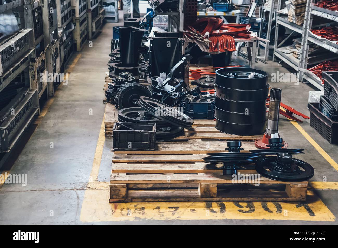 Components for agricultural machinery in warehouse of plant for ...