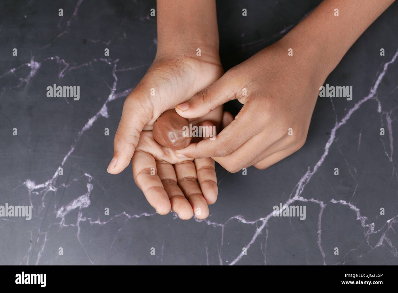 Hand pick dark chocolate top hi-res stock photography and images - Alamy