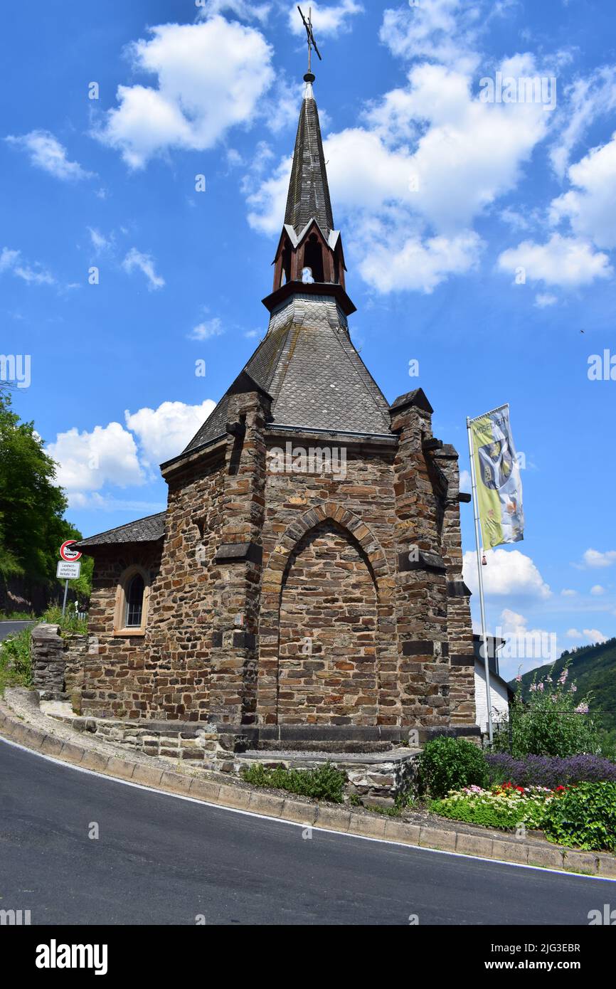 narrow curve road out of Moselkern to the Eifel, curve around a chapel ...