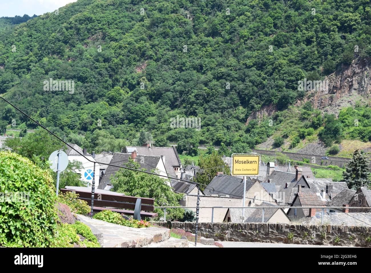 narrow curve road out of Moselkern to the Eifel, curve around a chapel ...