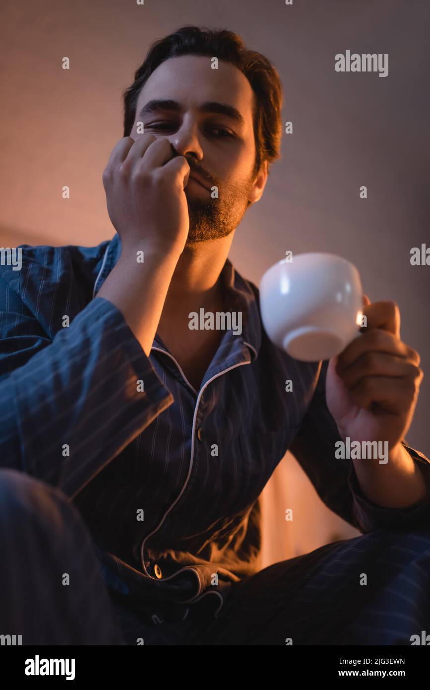 Sad man holding cup coffee hi-res stock photography and images - Alamy