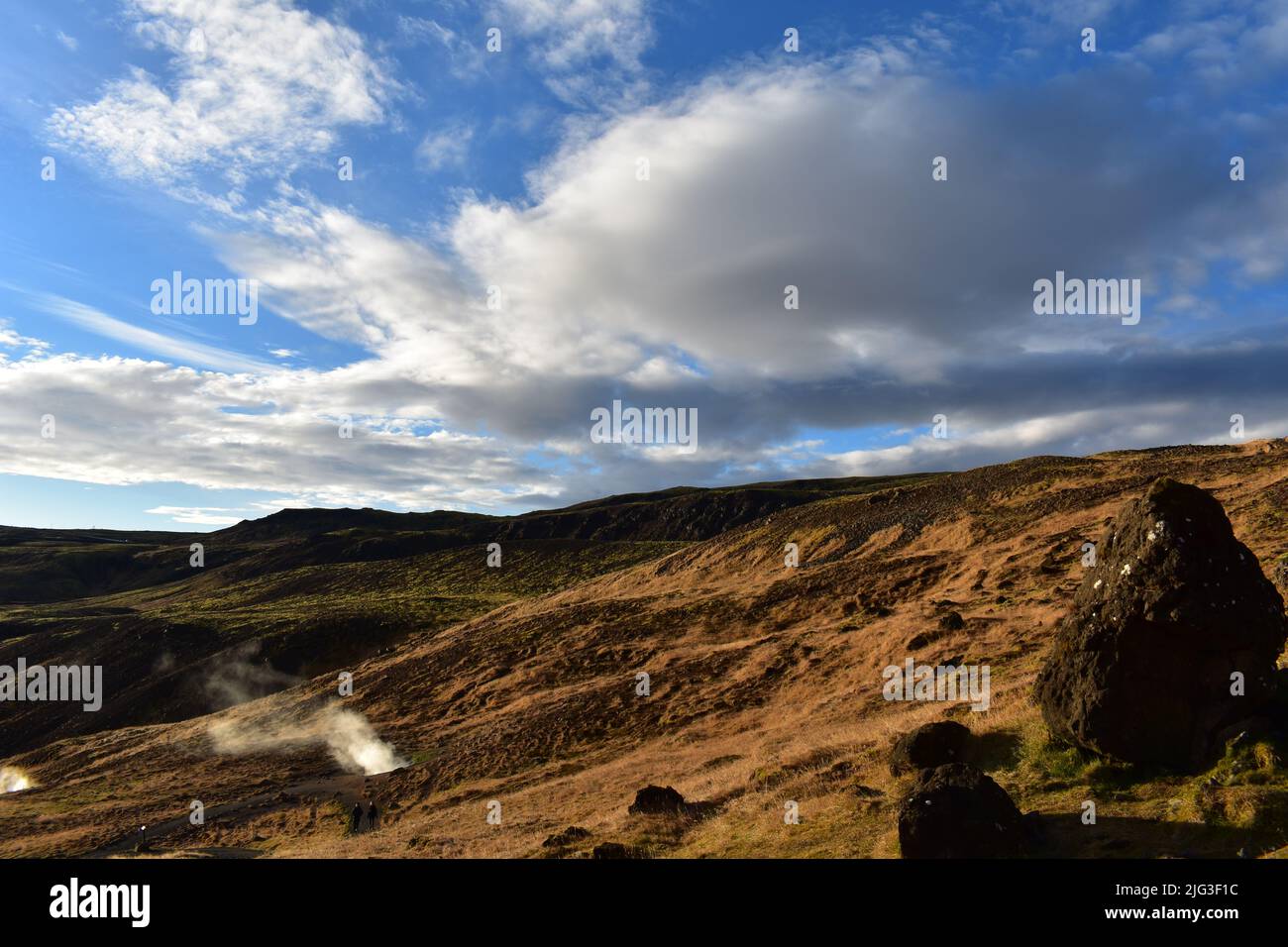 Volcanic hills in autumn sun. Reykjadalur, the Valley of Steam ...