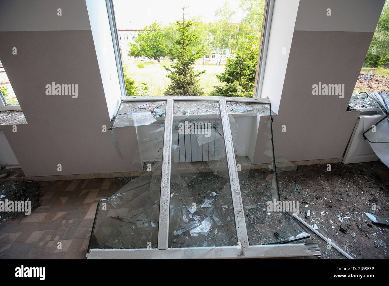 KHARKIV, UKRAINE - JULY 5, 2022 - A smashed window is pictured in a ...