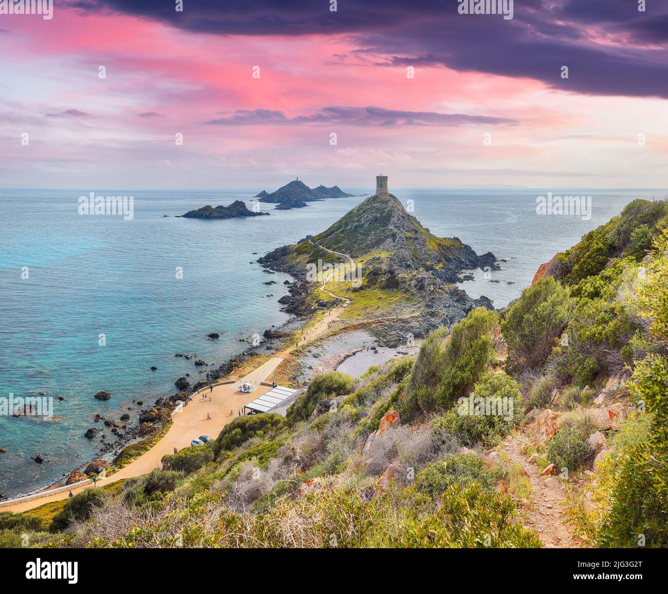 Sunset over popular tourist destination Torra di a Parata with Genoese ...