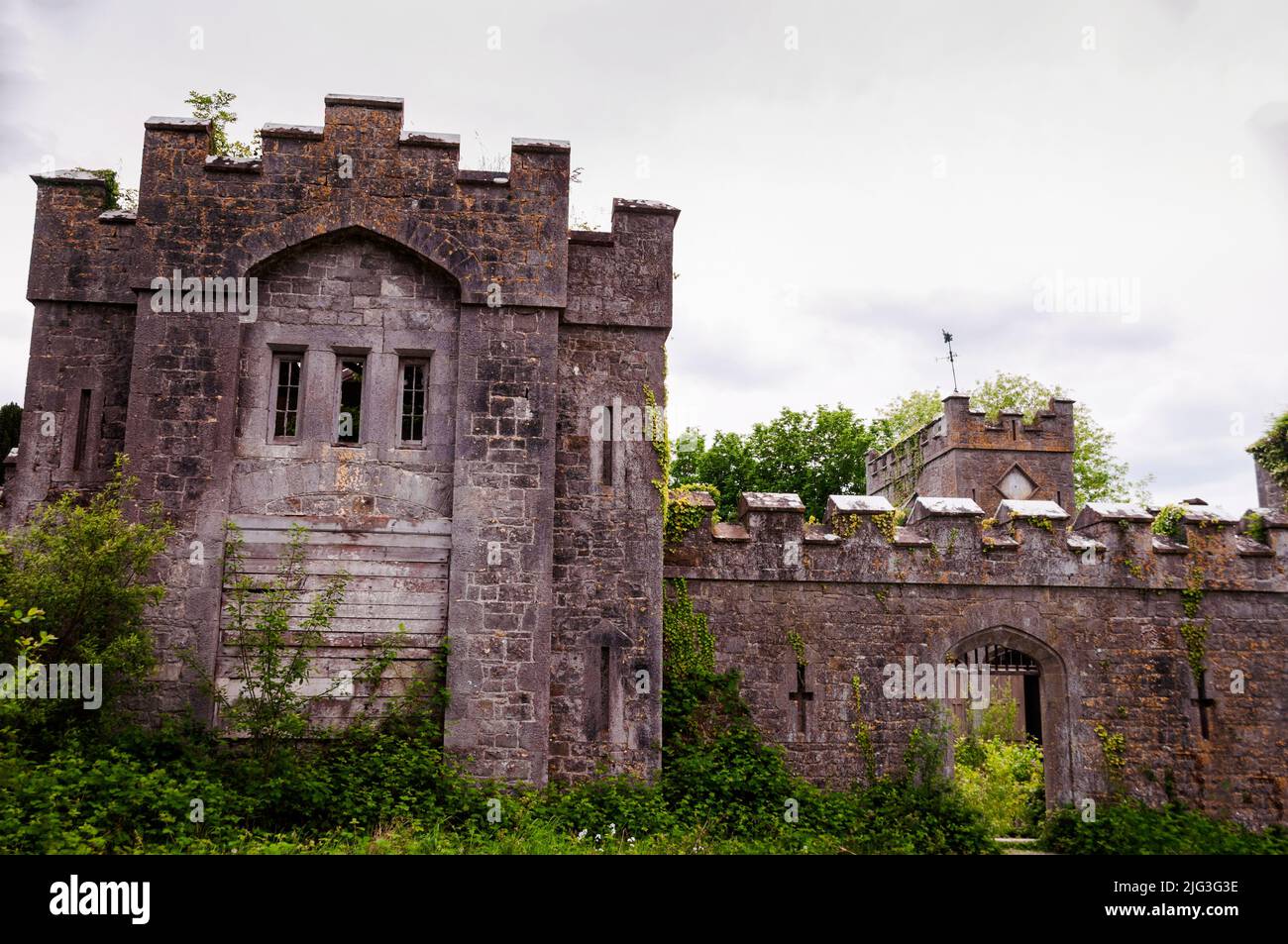Crenellations and pointed arch gate at the abandoned Gothic Revival ...