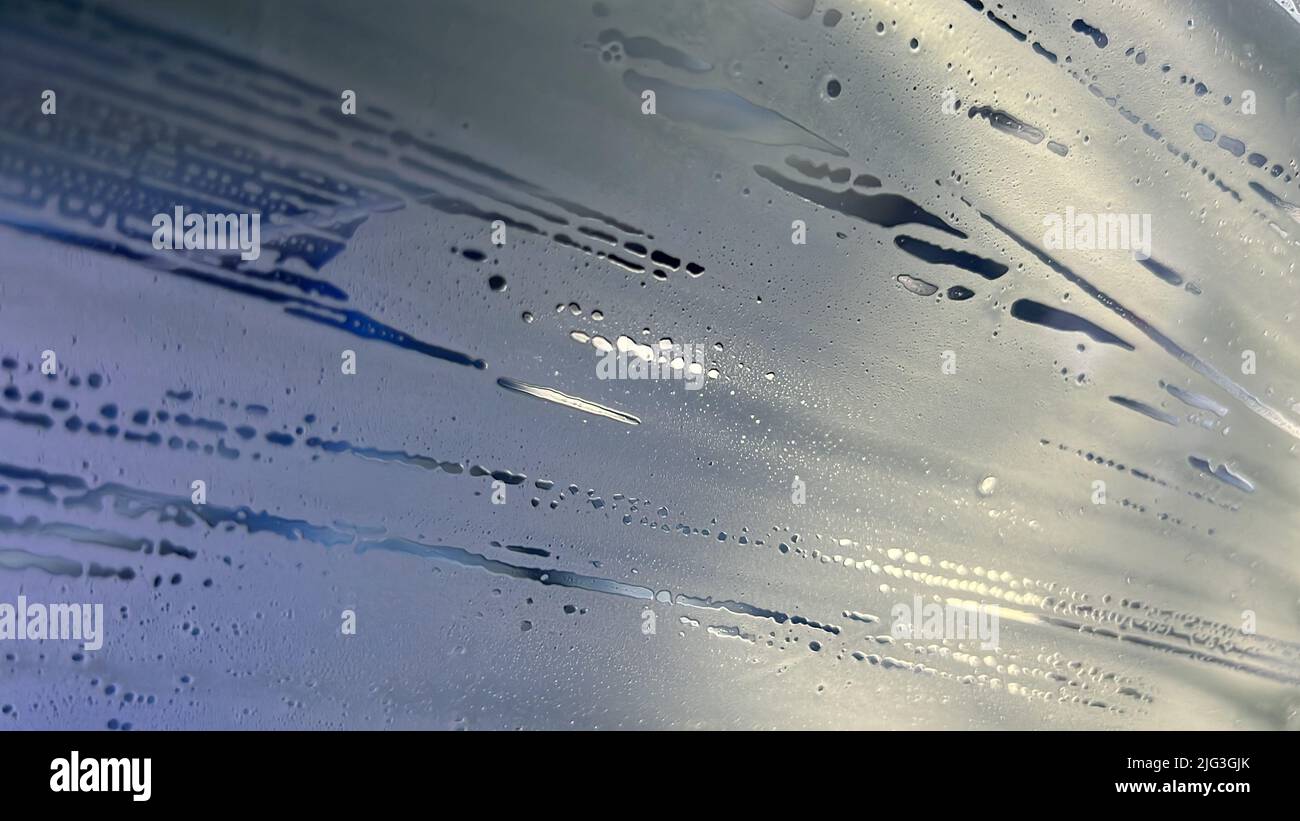 Abstract background - view through windshield of a car going through ...