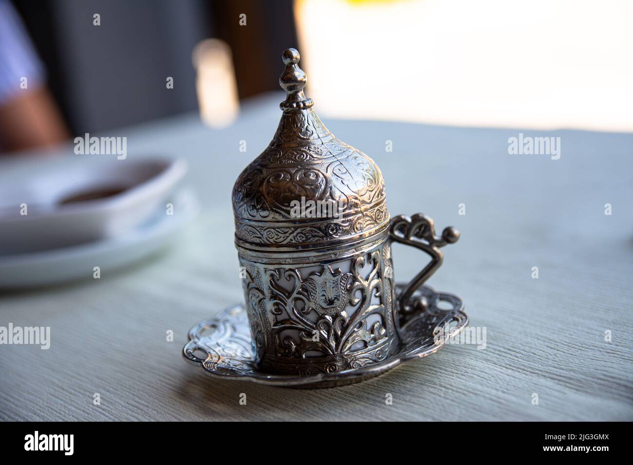 Turkish coffee in a beautiful traditional cup with a stylish lid ...