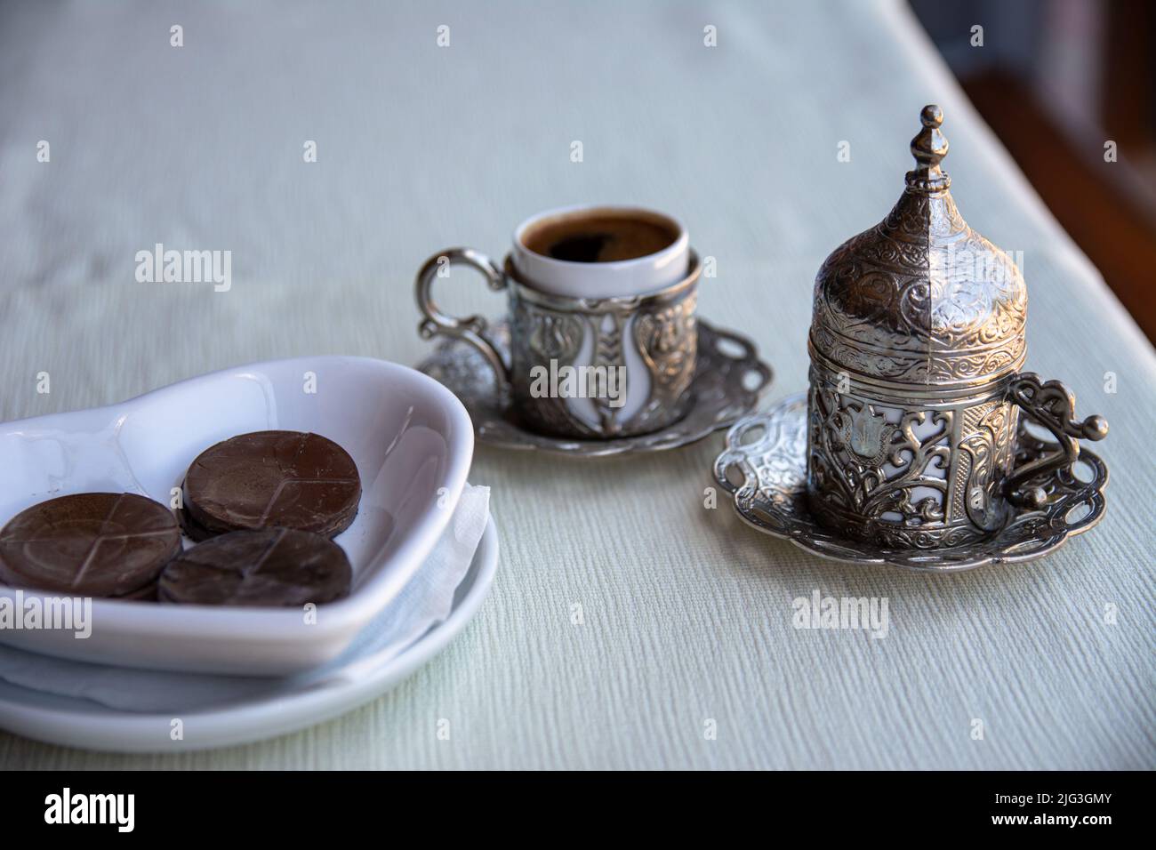 Turkish coffee in a beautiful traditional cup with a stylish lid ...