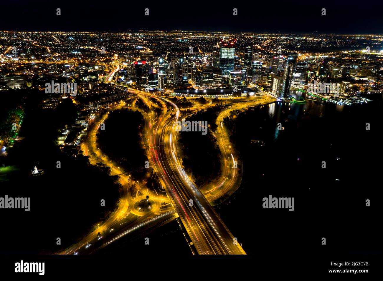 Aerial long exposure of Perth city at night including the freeway ...
