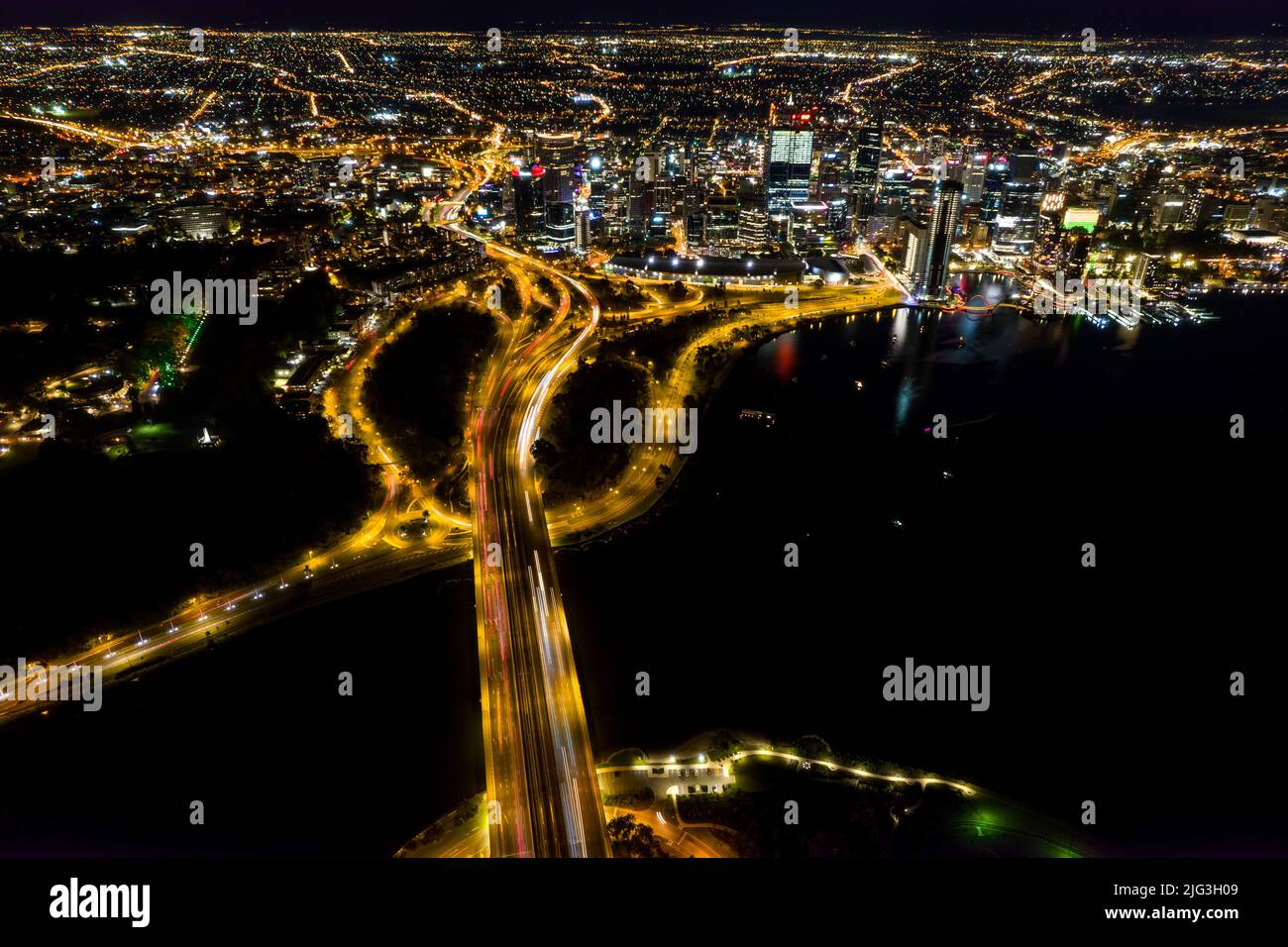 Aerial long exposure of Perth city at night including the freeway ...