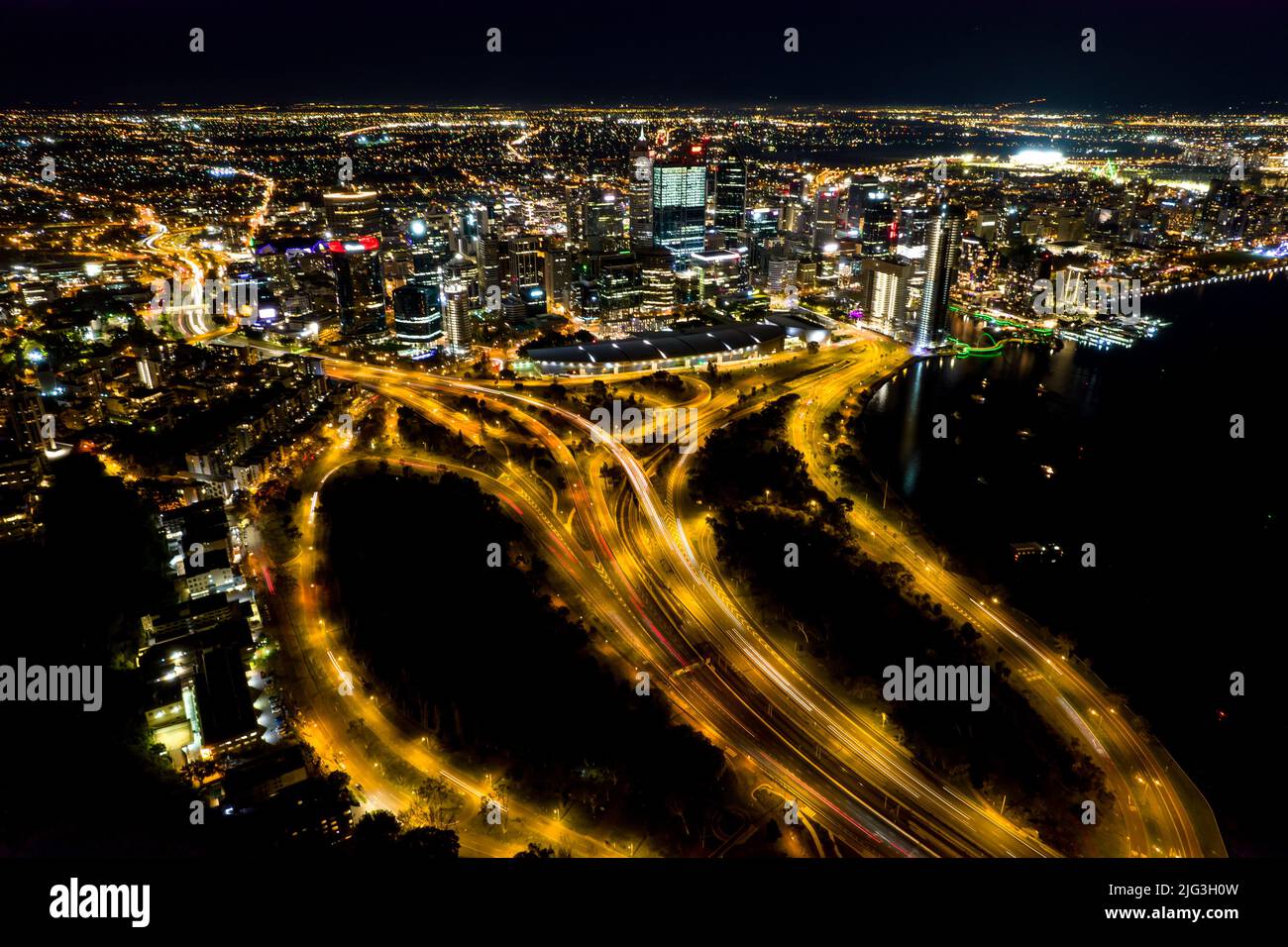 Aerial long exposure of Perth city at night including the freeway ...