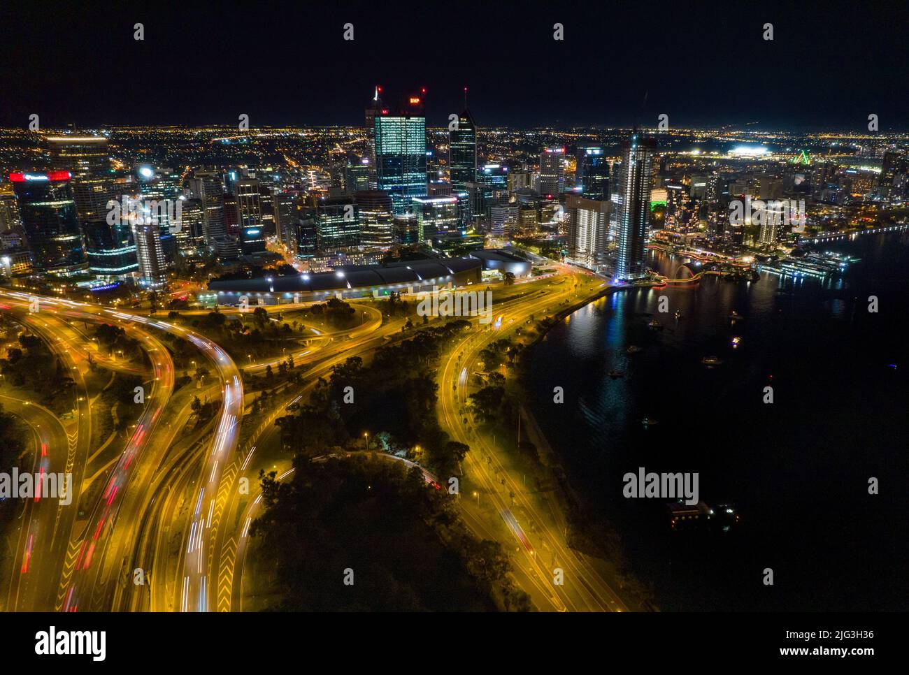 Aerial long exposure of Perth city at night including the freeway ...