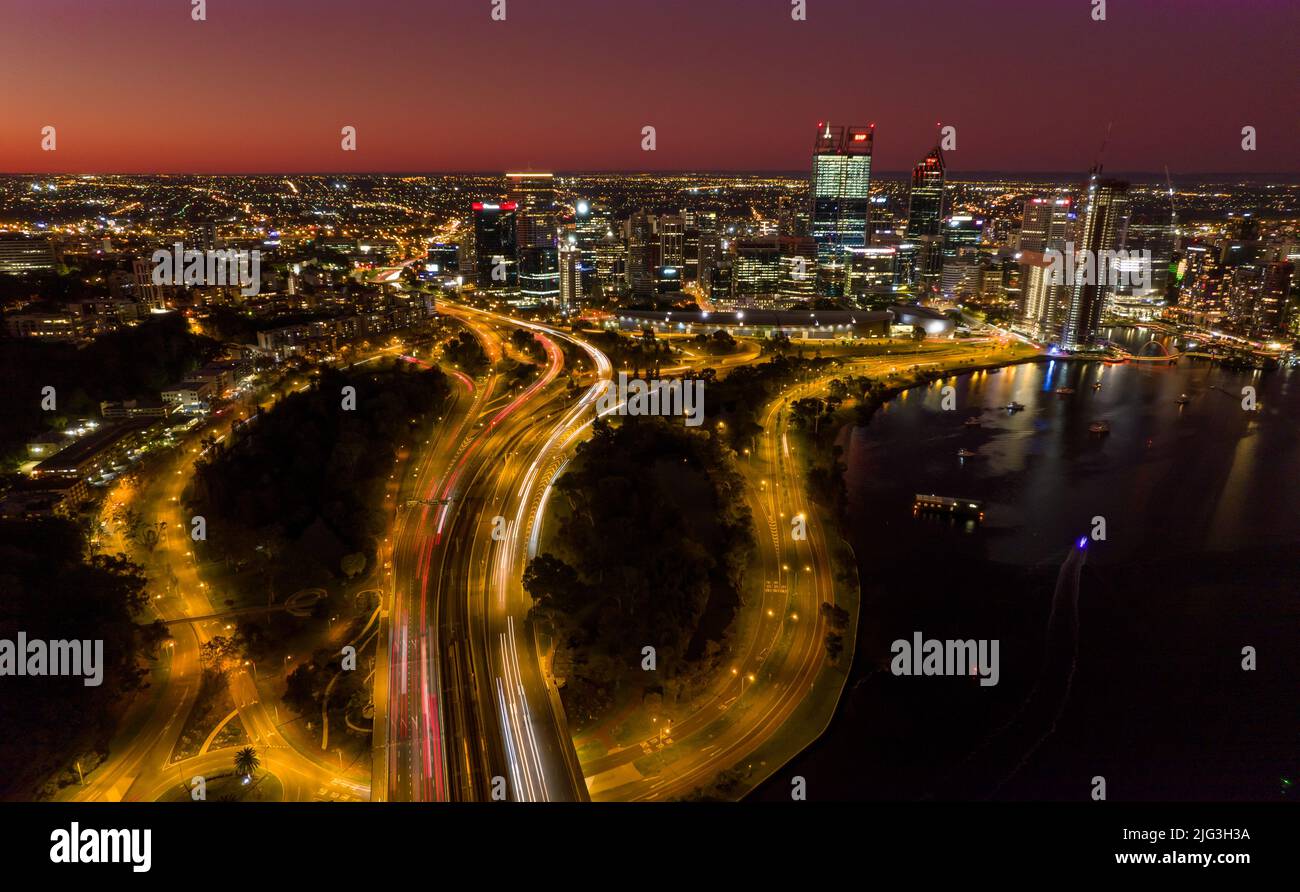 Aerial long exposure of Perth city at night including the freeway ...