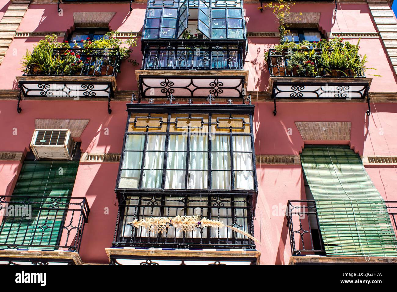 Seville, Spain - July 04, 2022 Facade of a building in the streets of ...