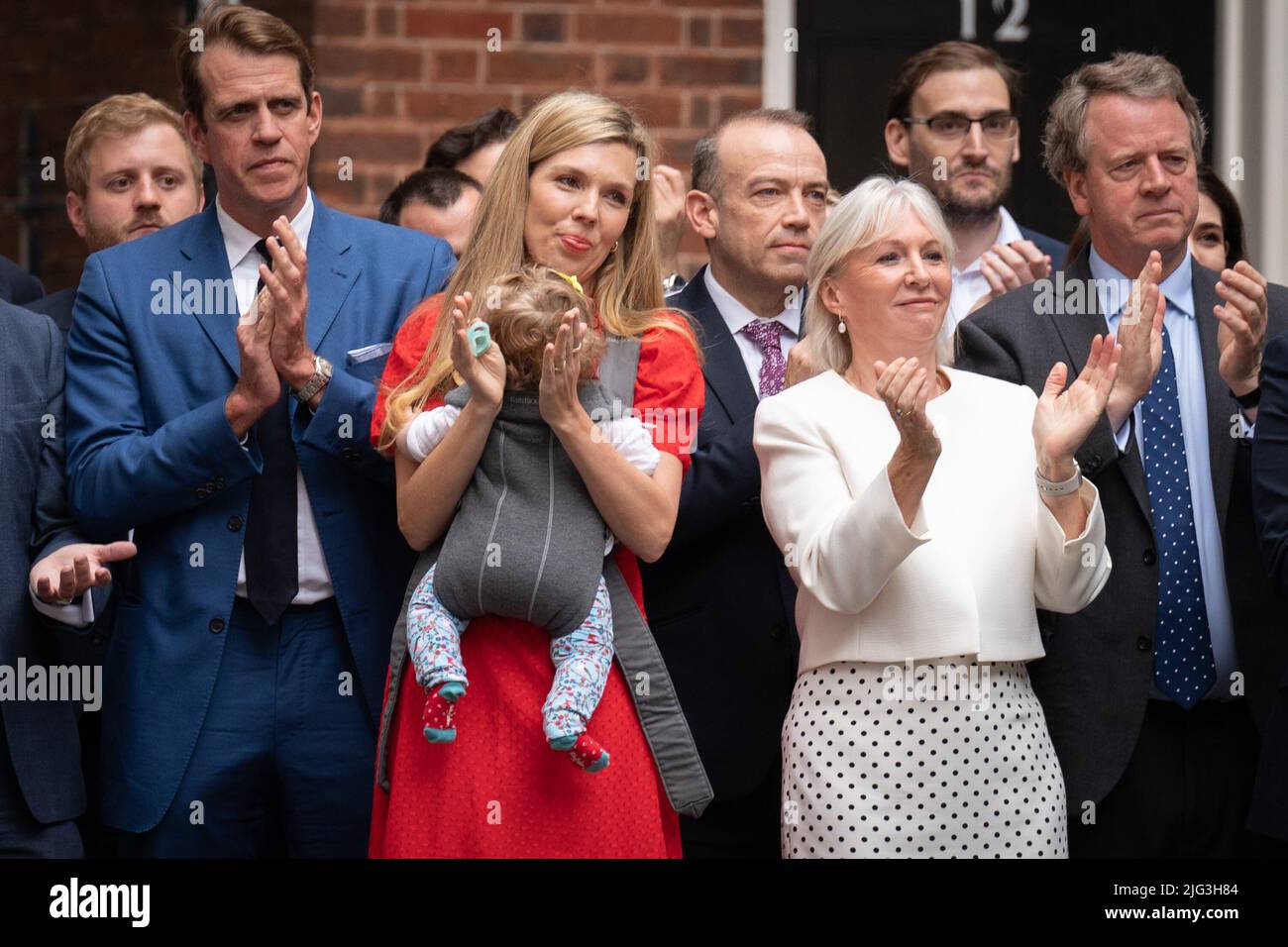 Carrie Johnson holding her daughter Romy, with Nadine Dorries, watches ...