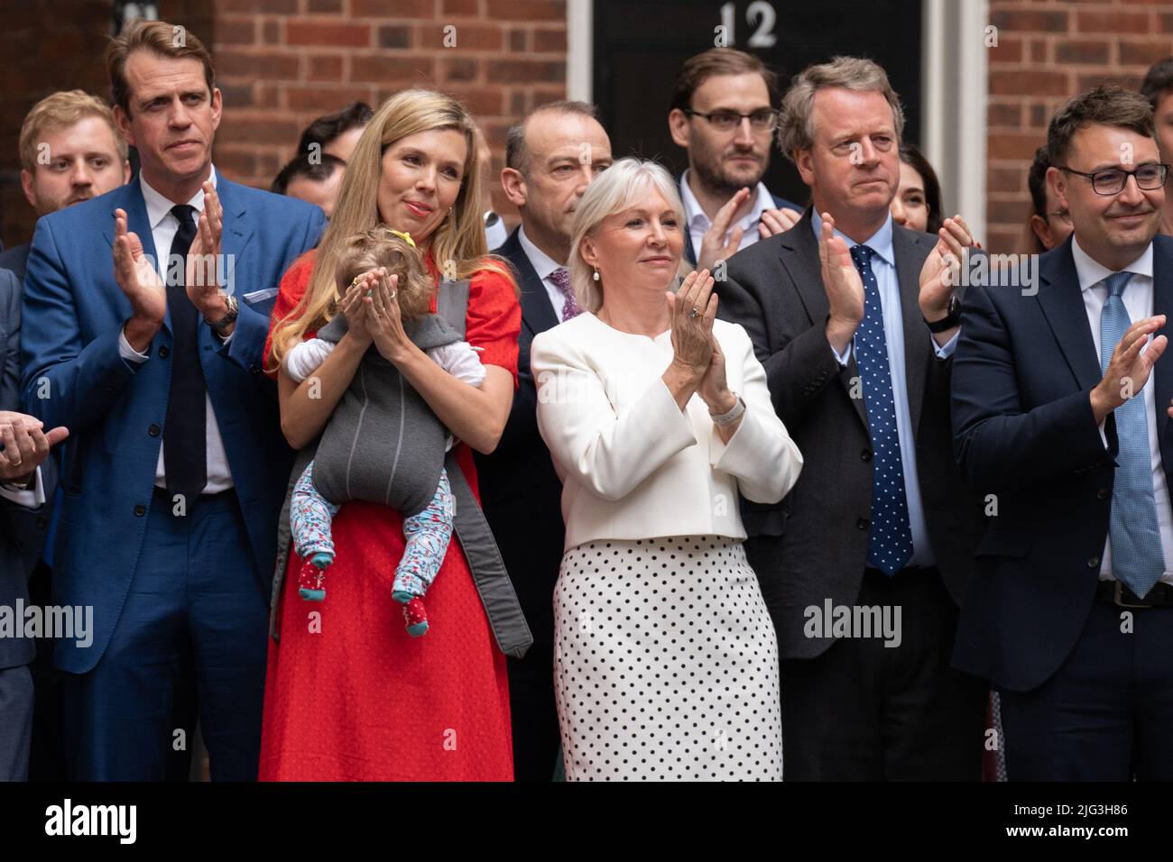 Carrie Johnson holding her daughter Romy, with Nadine Dorries, watches ...