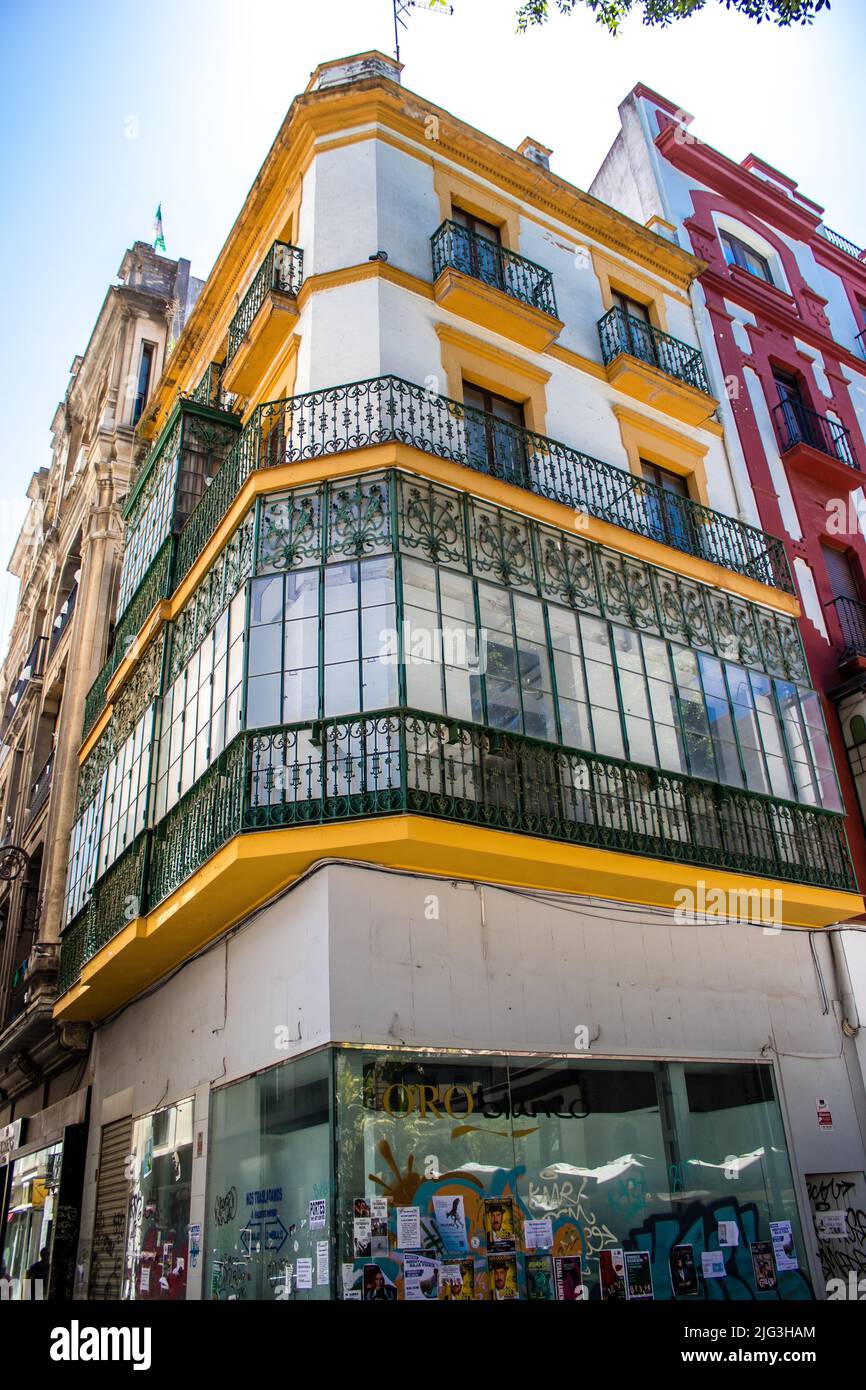Seville, Spain - July 04, 2022 Facade of a building in the streets of ...