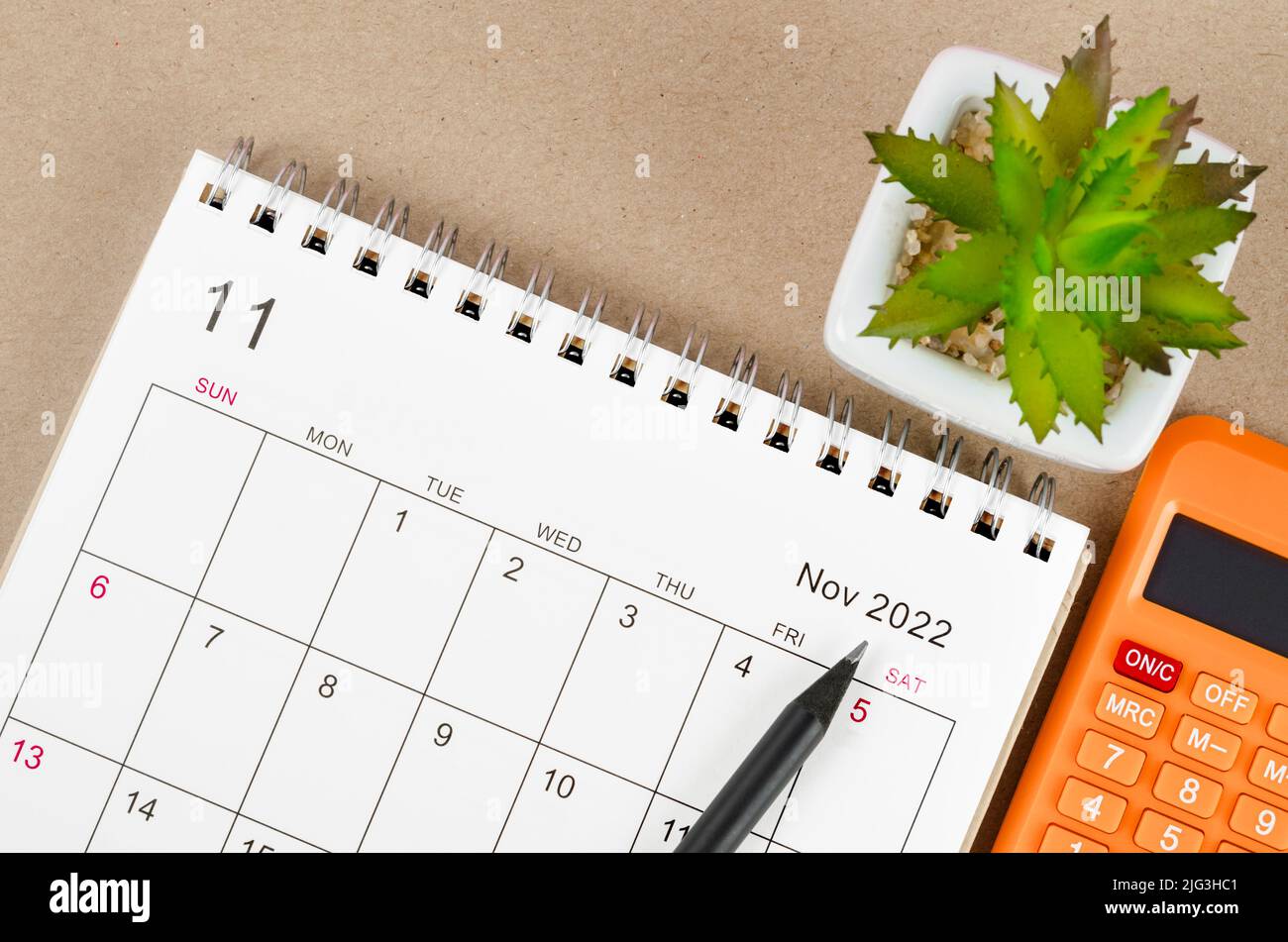 The November 2022 desk calendar with calculator Stock Photo - Alamy