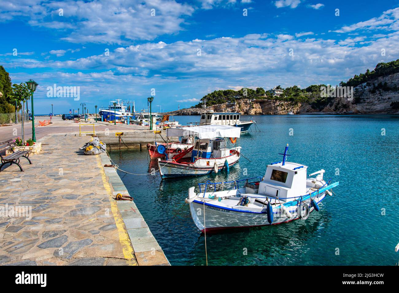 Traditional fishing boats at the picturesque port of Patitiri in ...